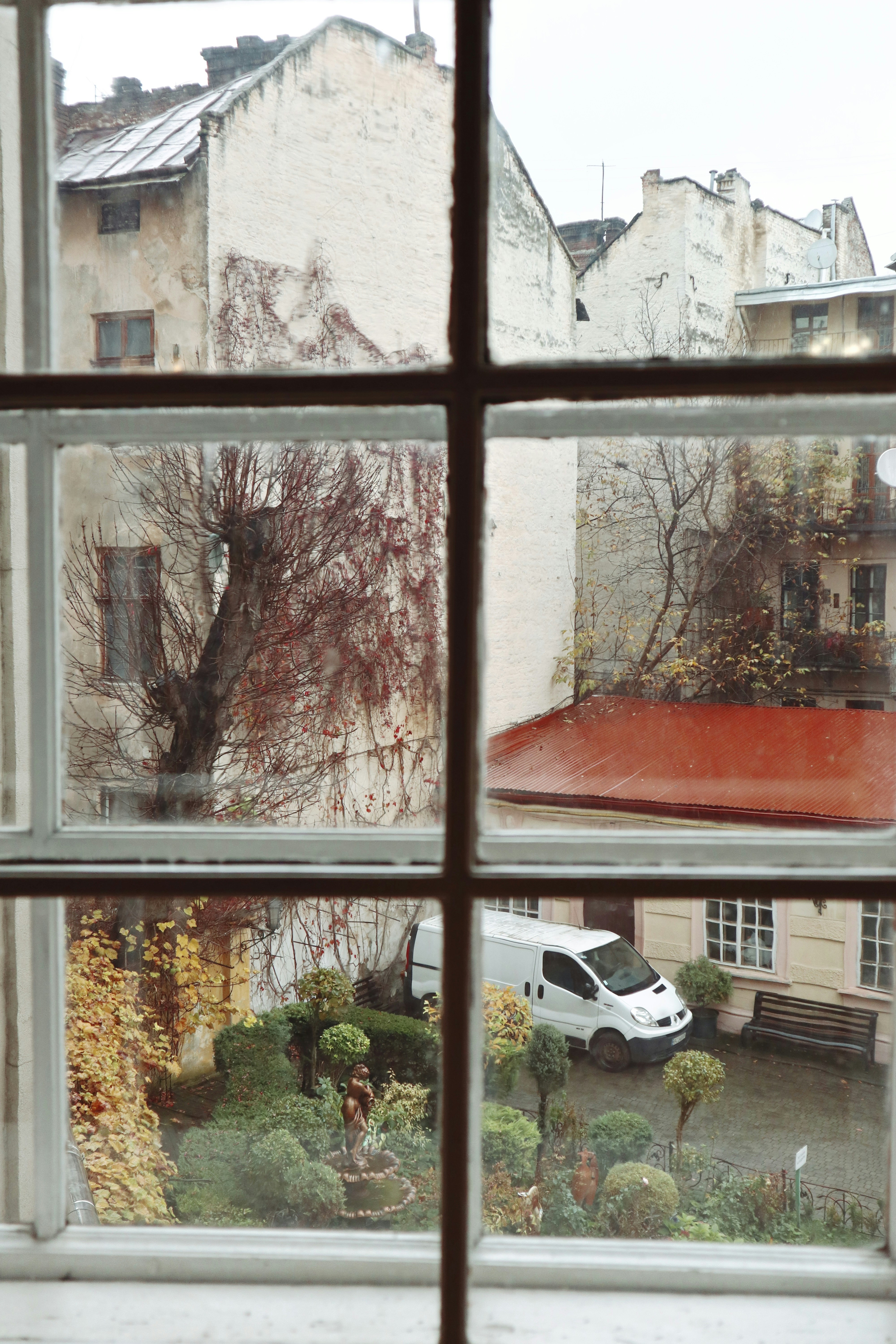 A Quiet Courtyard Sees Through a WIndow Grid