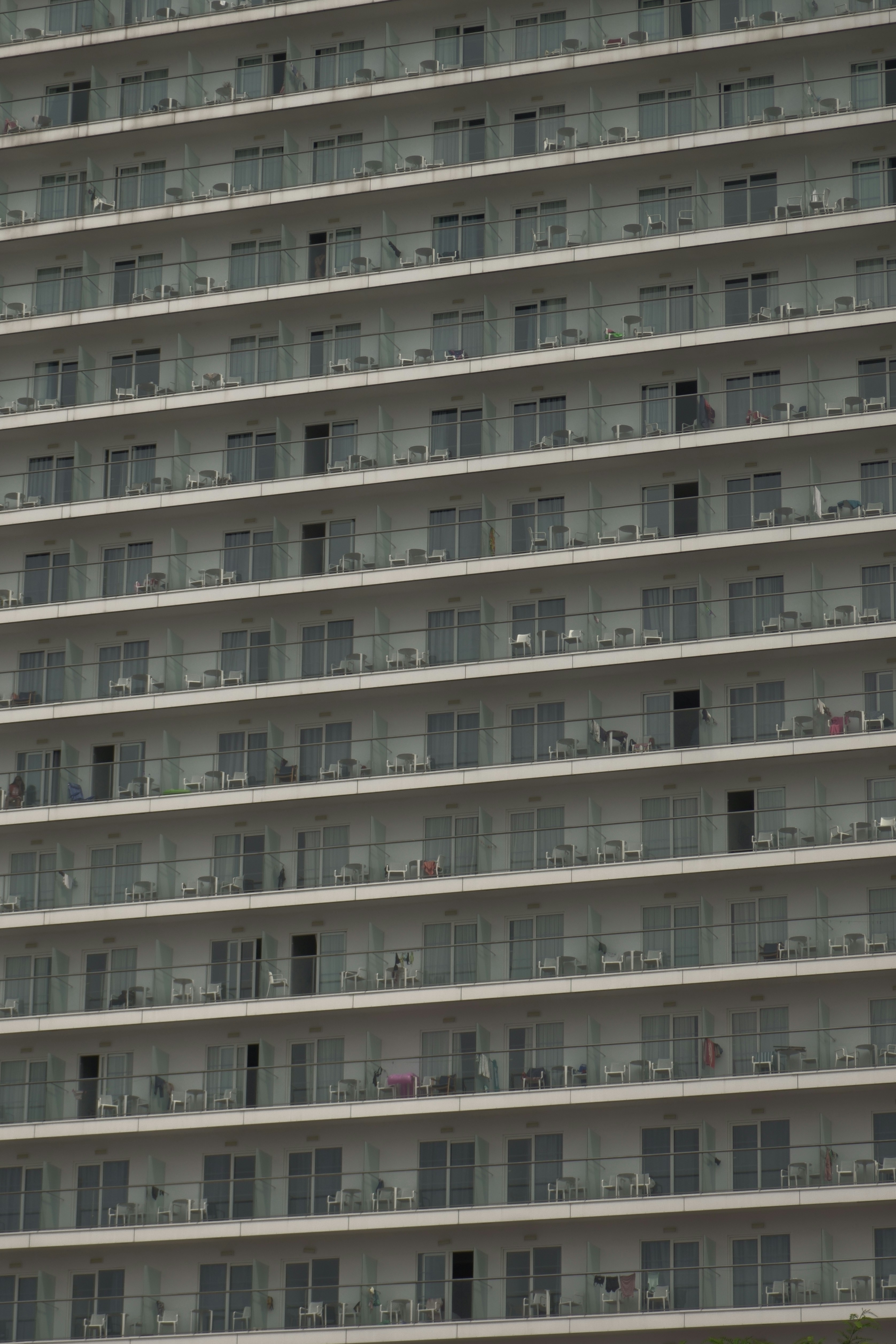 Rows of Quiet Balconies: A Steel-and-Glass Facade Repeats