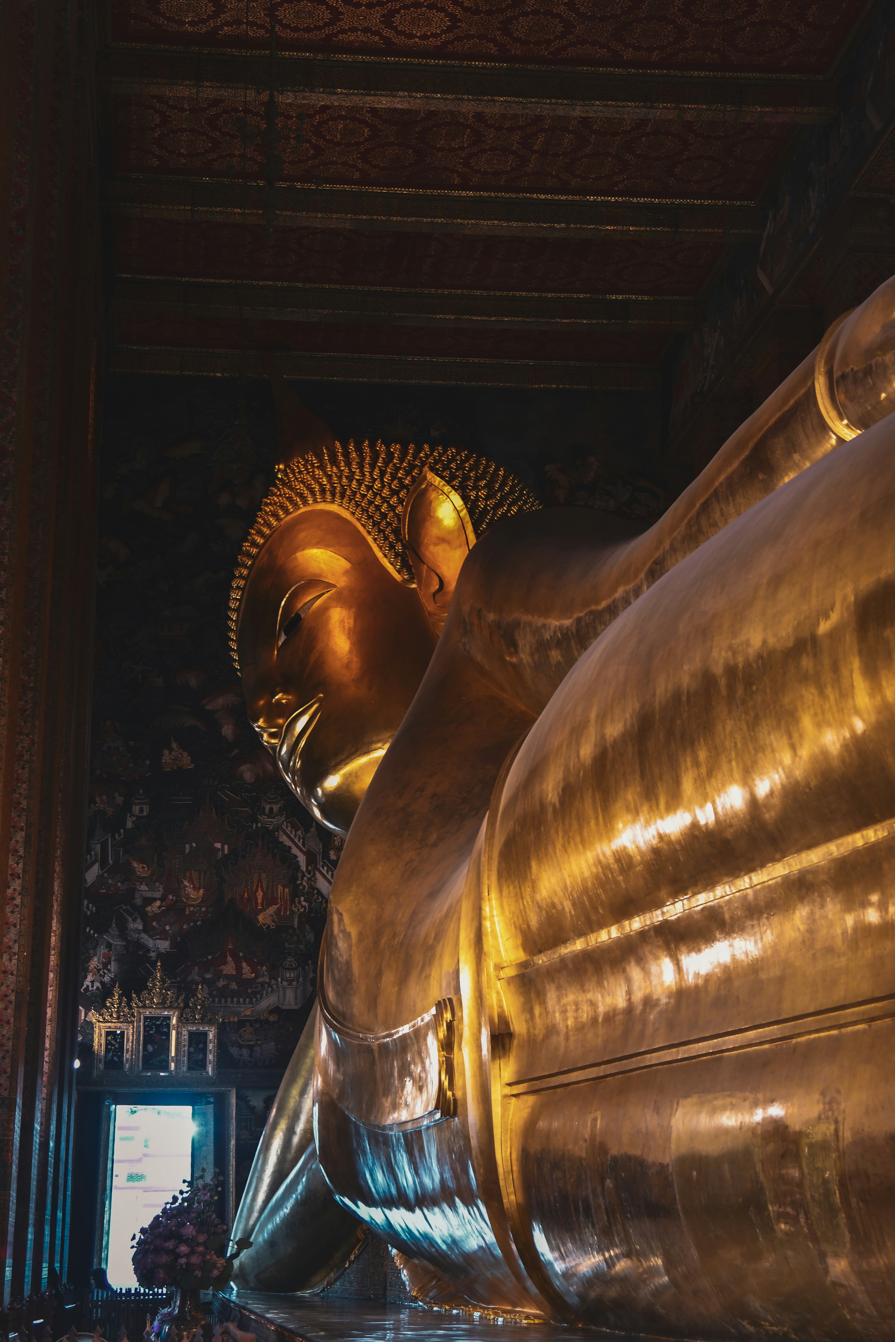 Golden Recline: A Reclining Buddha Silhouette in Warm Monument Light