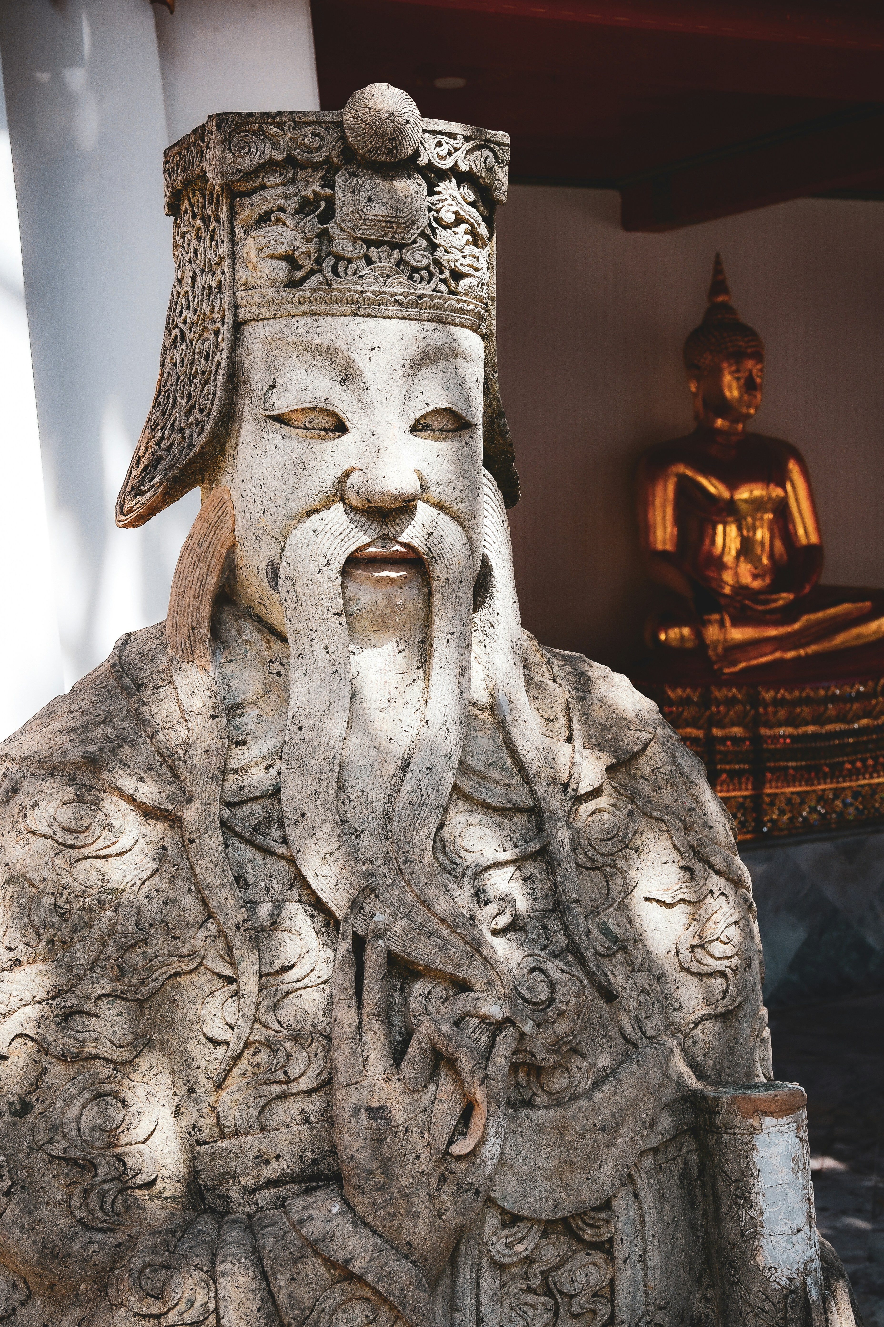 Stone Sage: A Carved Guardian with a Genteel Gaze