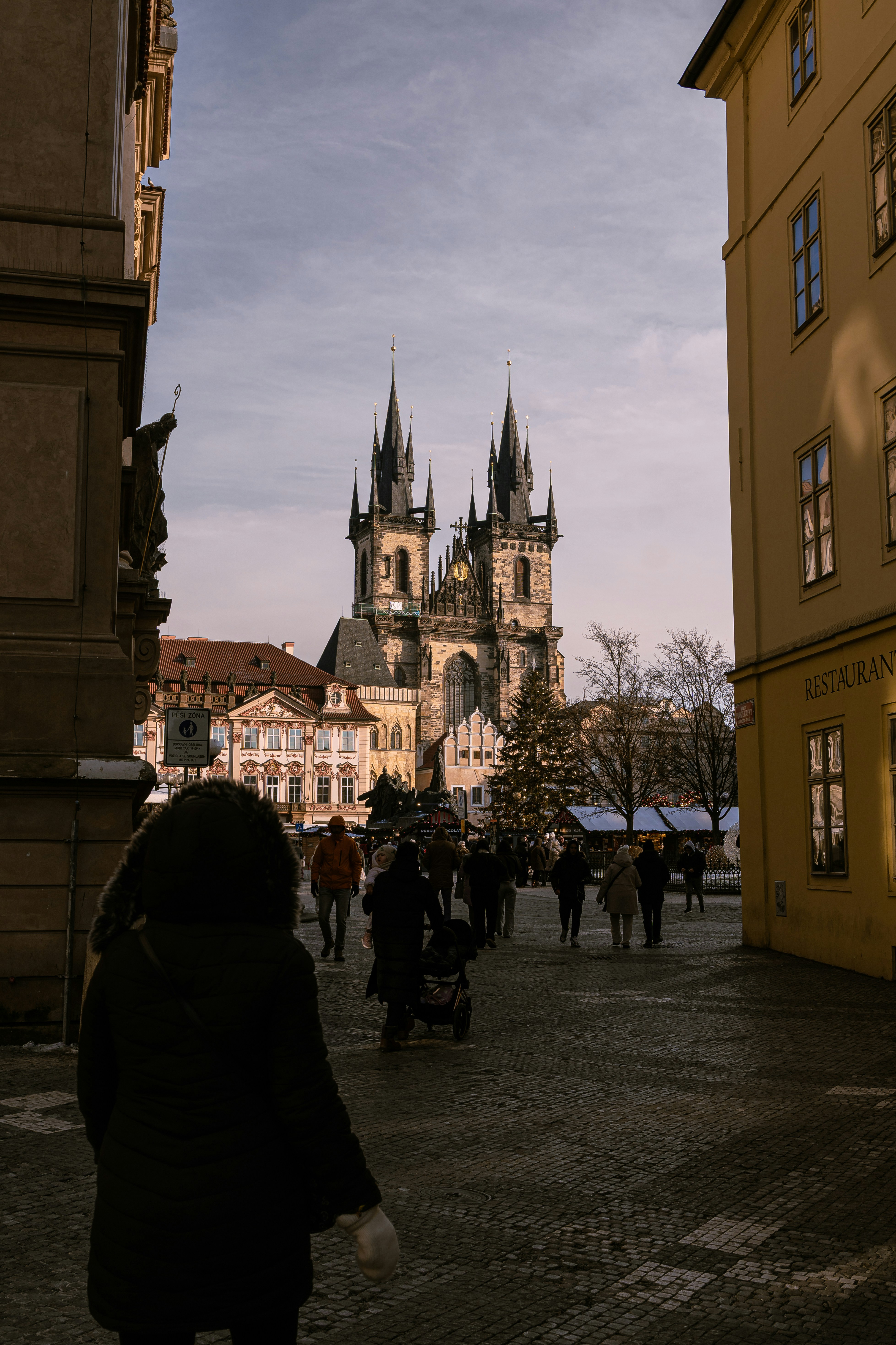 Gothic Spires Above a Quiet Cobblestone Square
