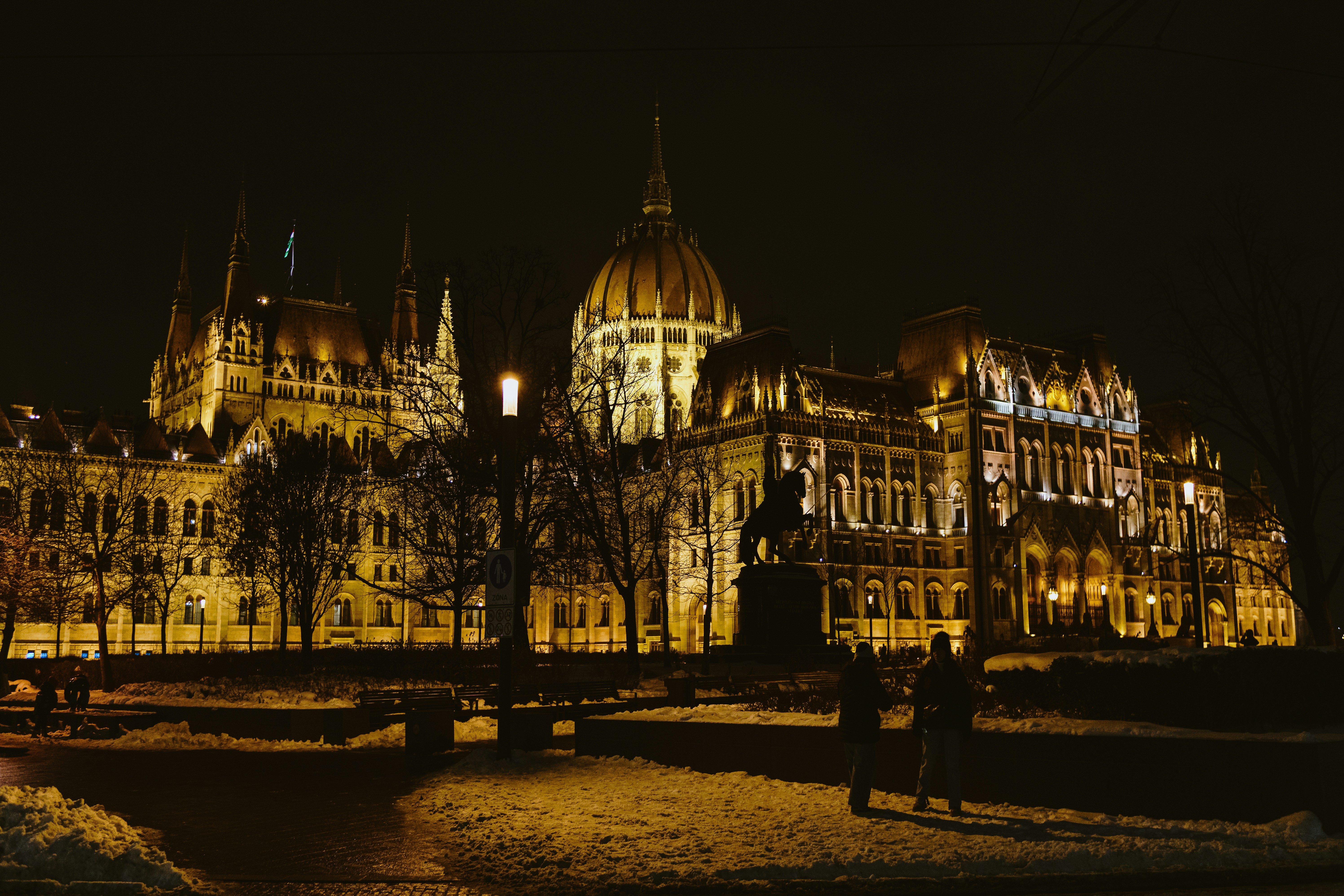 Golden Facade at Night: A Prague-Styled Parliament in Warm Glow