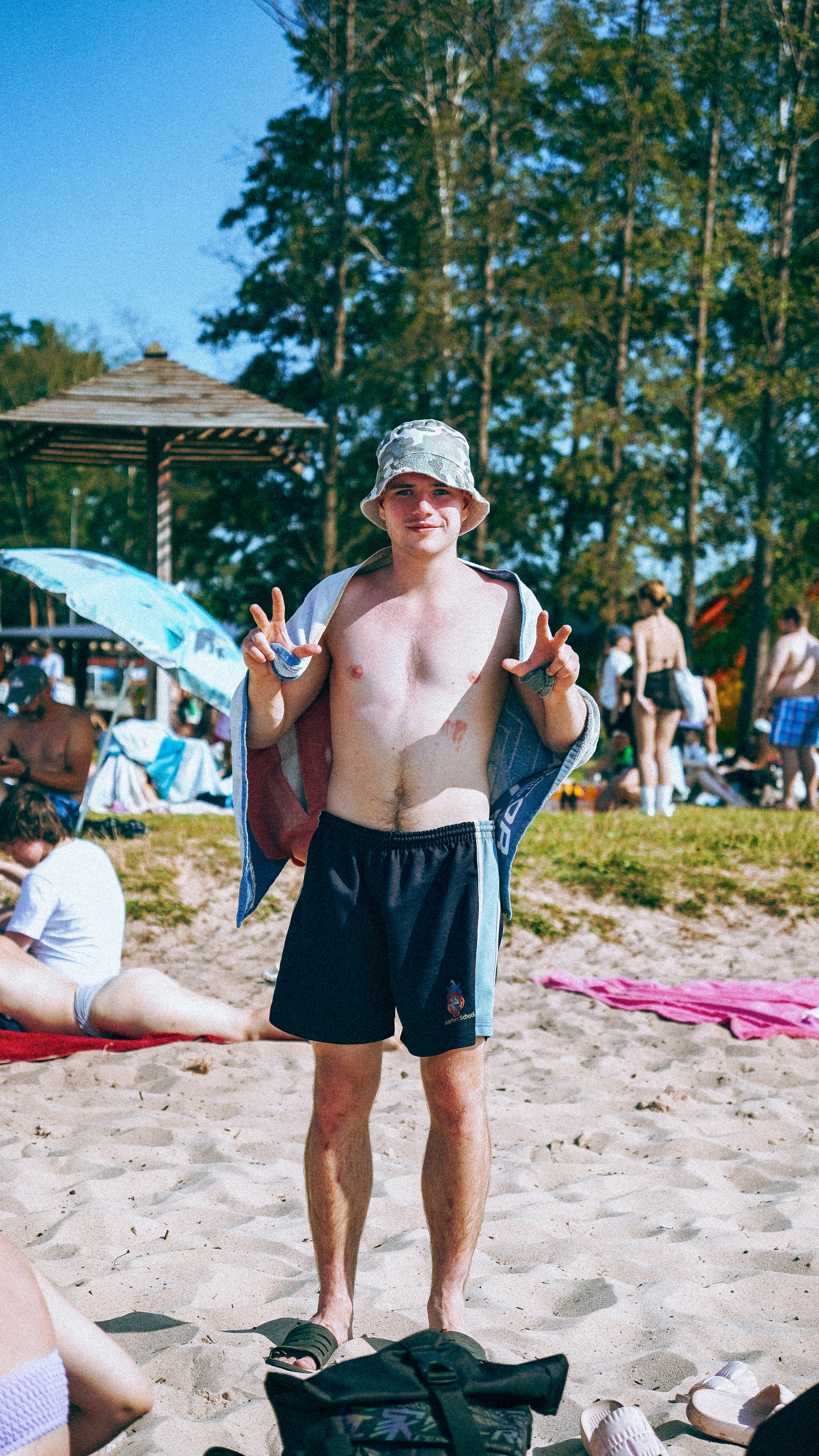 Sunlit Beach Portrait: A Gauzy Smile and Peace Sign