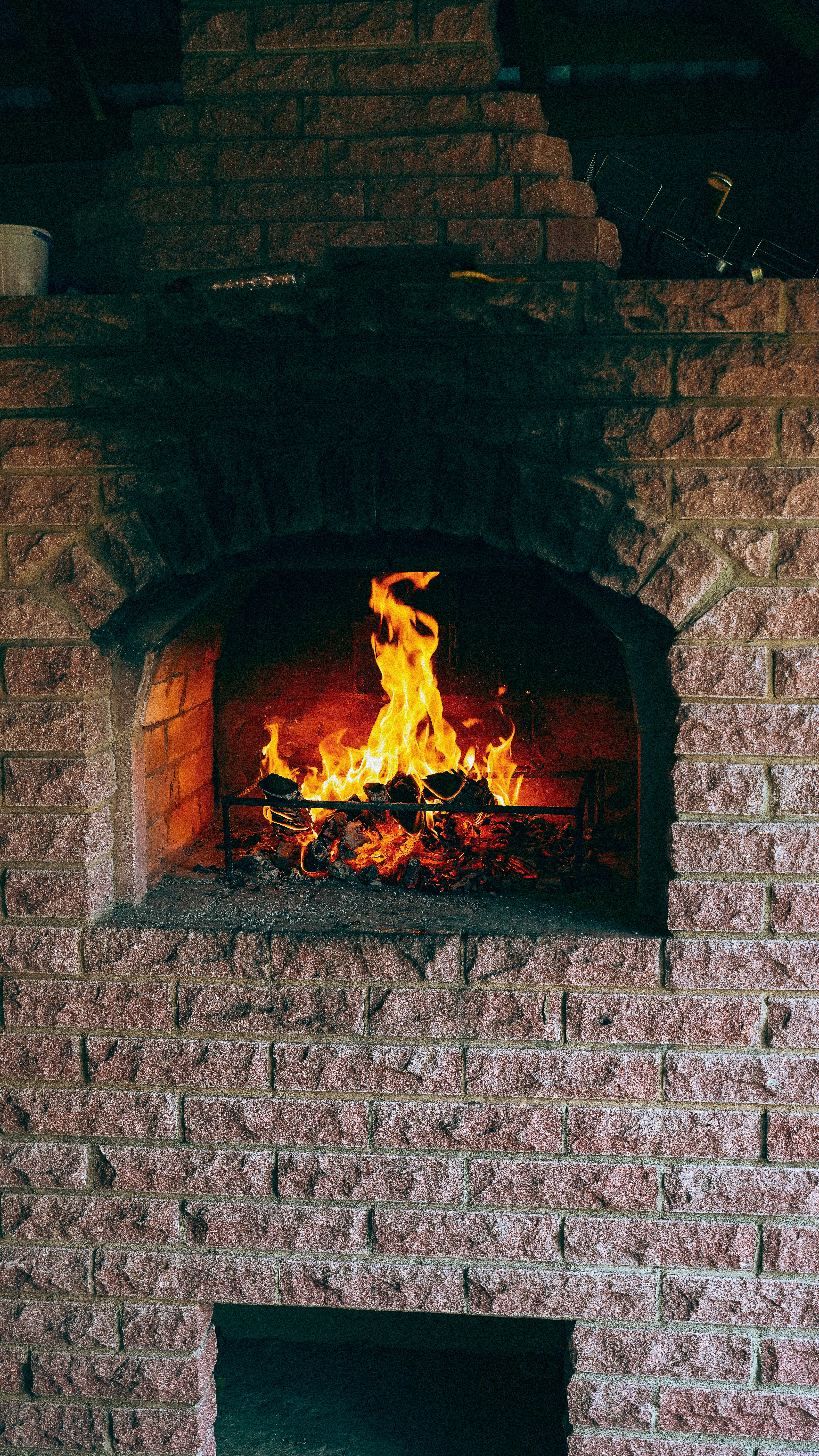 Cozy Hearth Under Brick Arches: Firelight in the Smoke