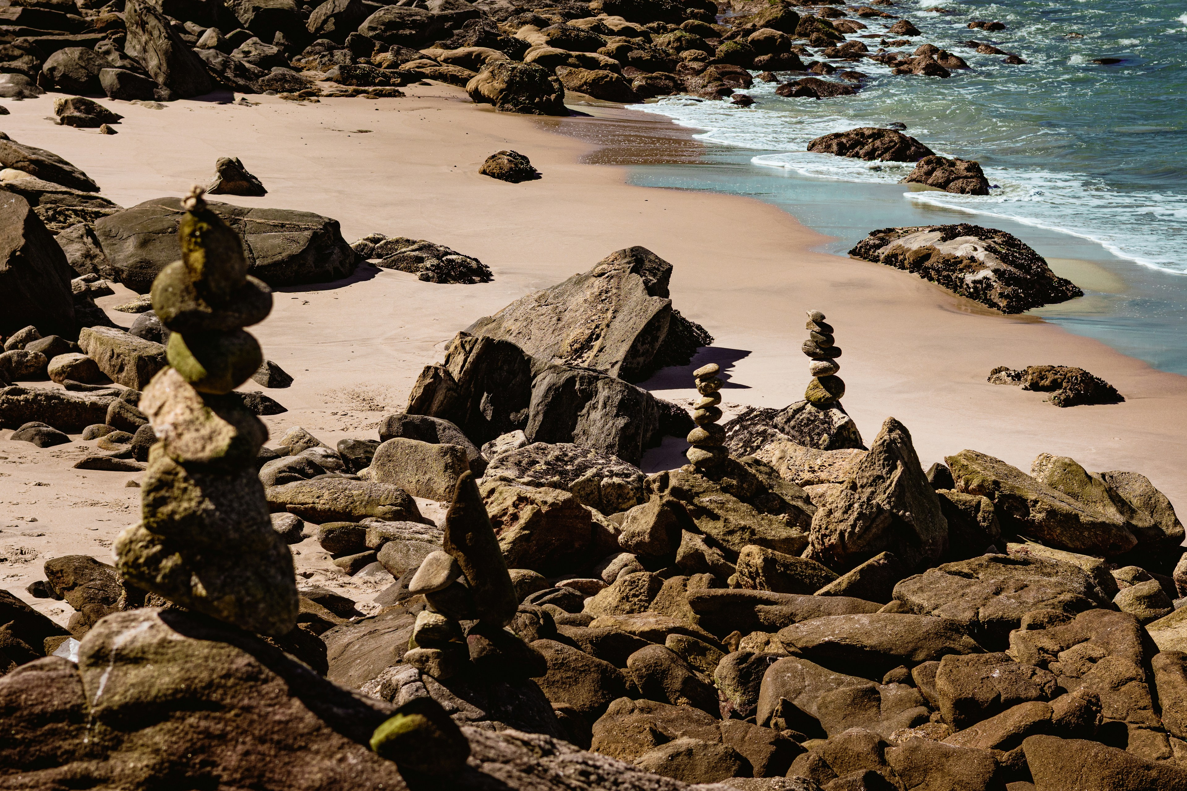 Balanced Stones on a Quiet Coastal Shore