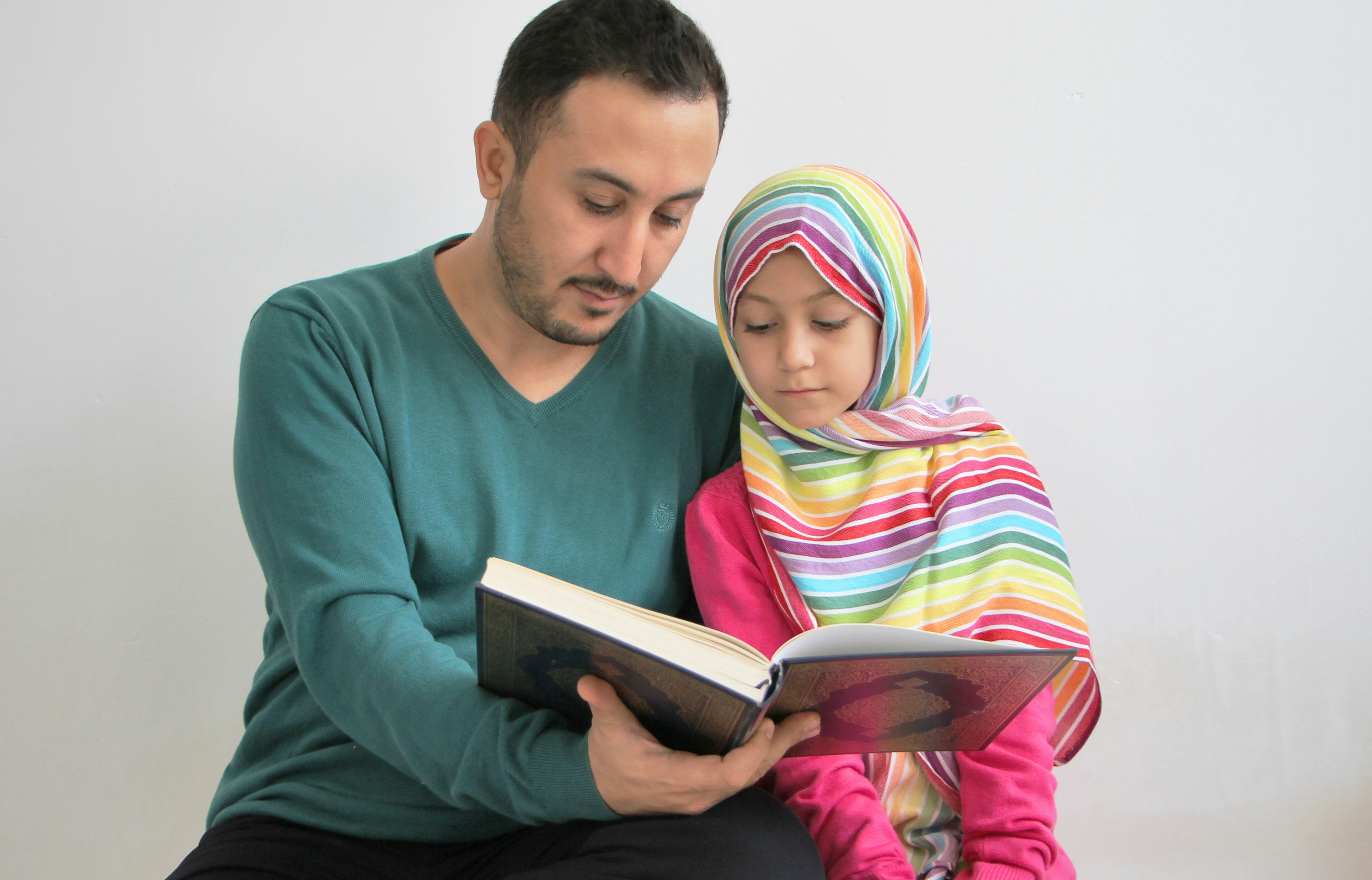 Reading Together: A Father and Daughter Share a Quiet Moment