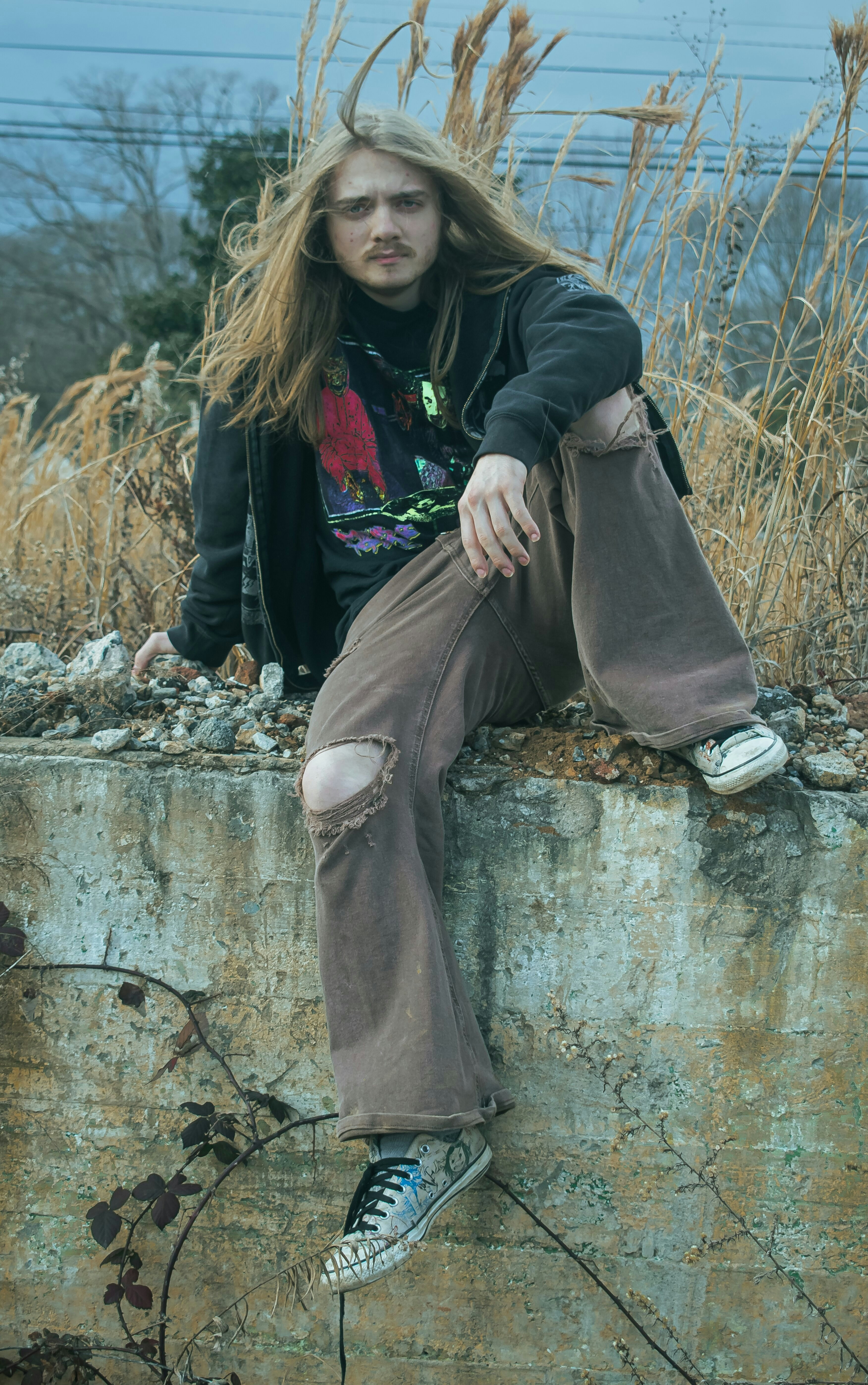 Lonely Edge: A Youth Portrait on Weathered Concrete