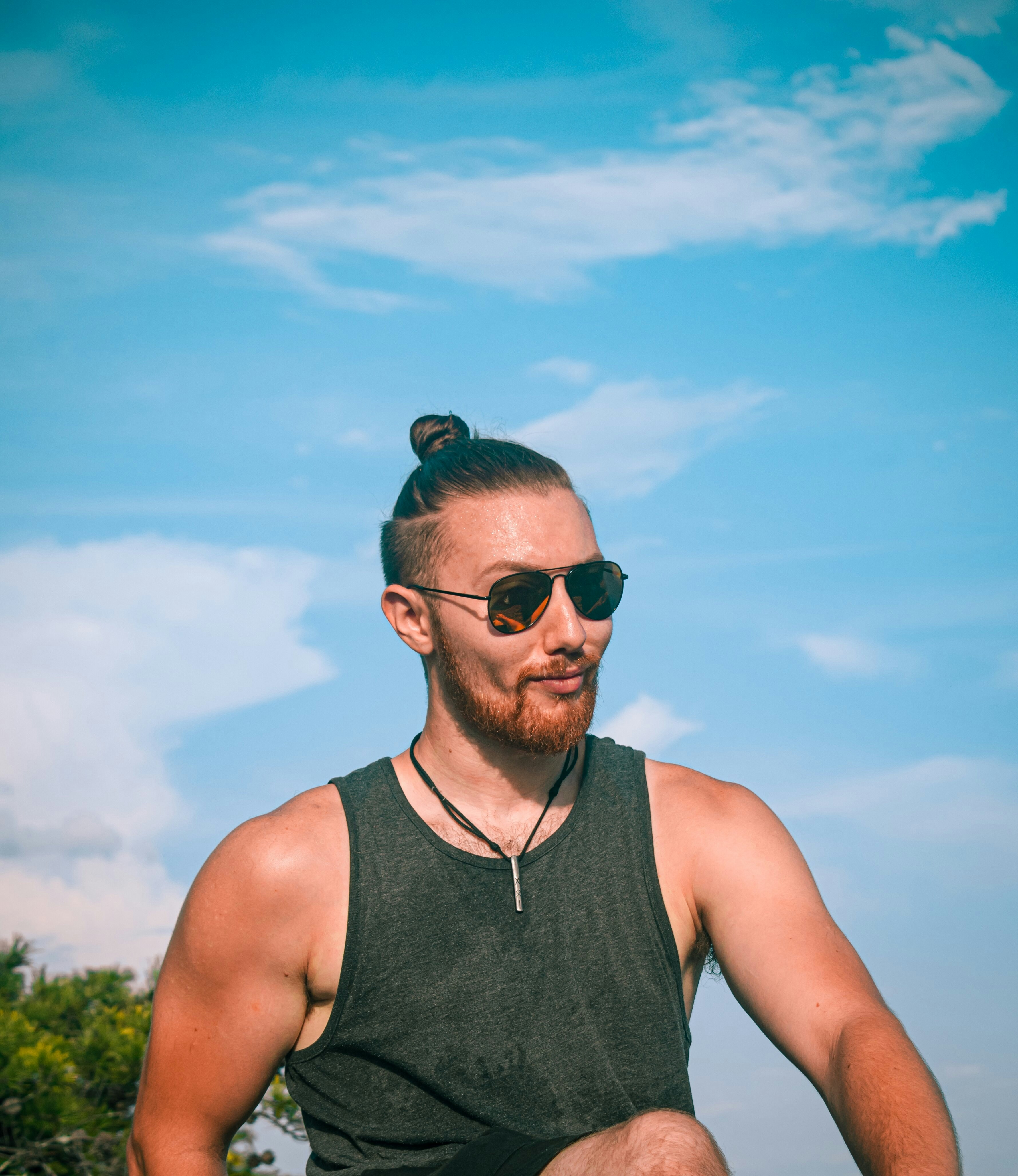 Man with Sunglasses in Sunny Skyline