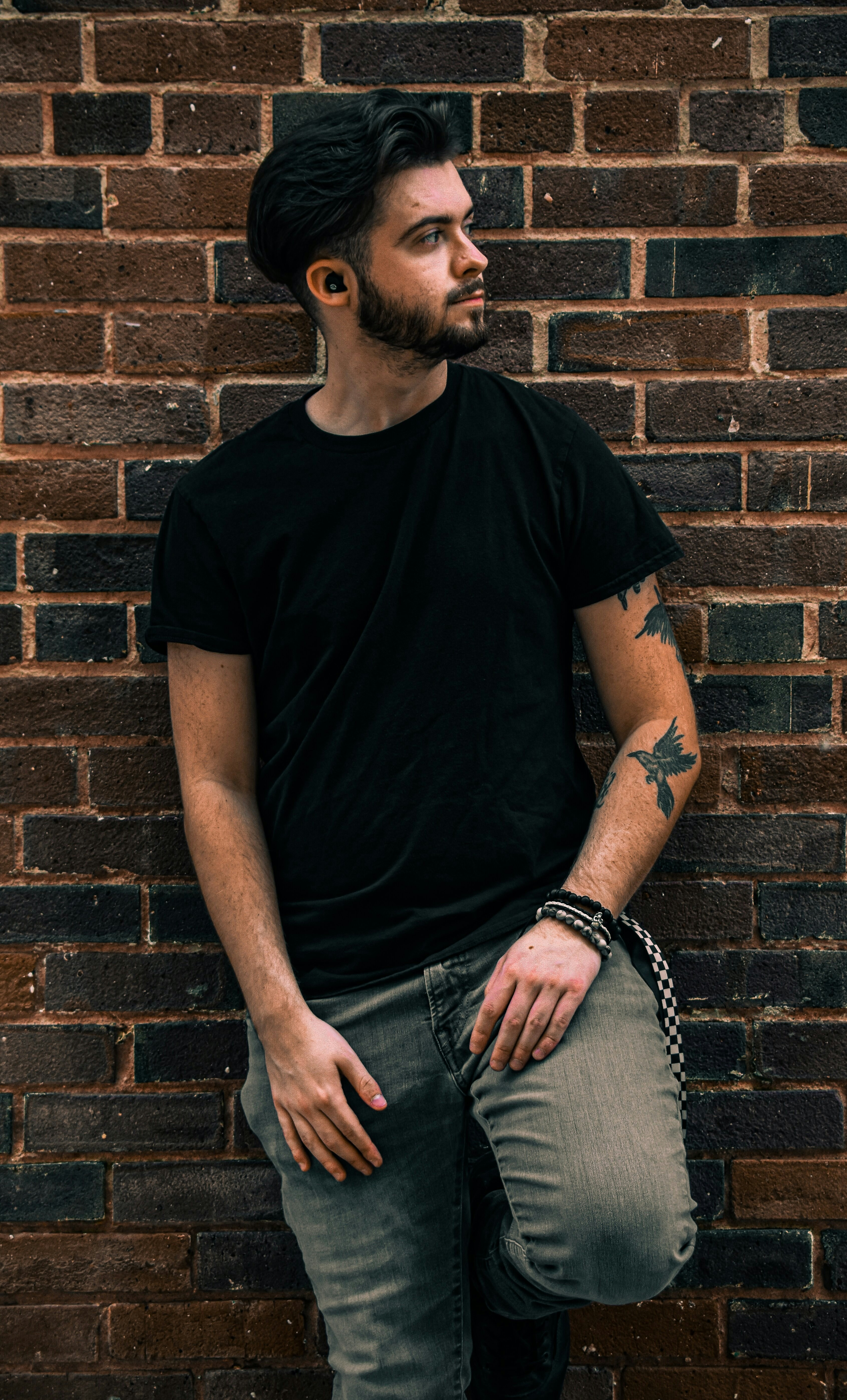 Midnight Wallflower: A Quiet Gaze Against Brick
