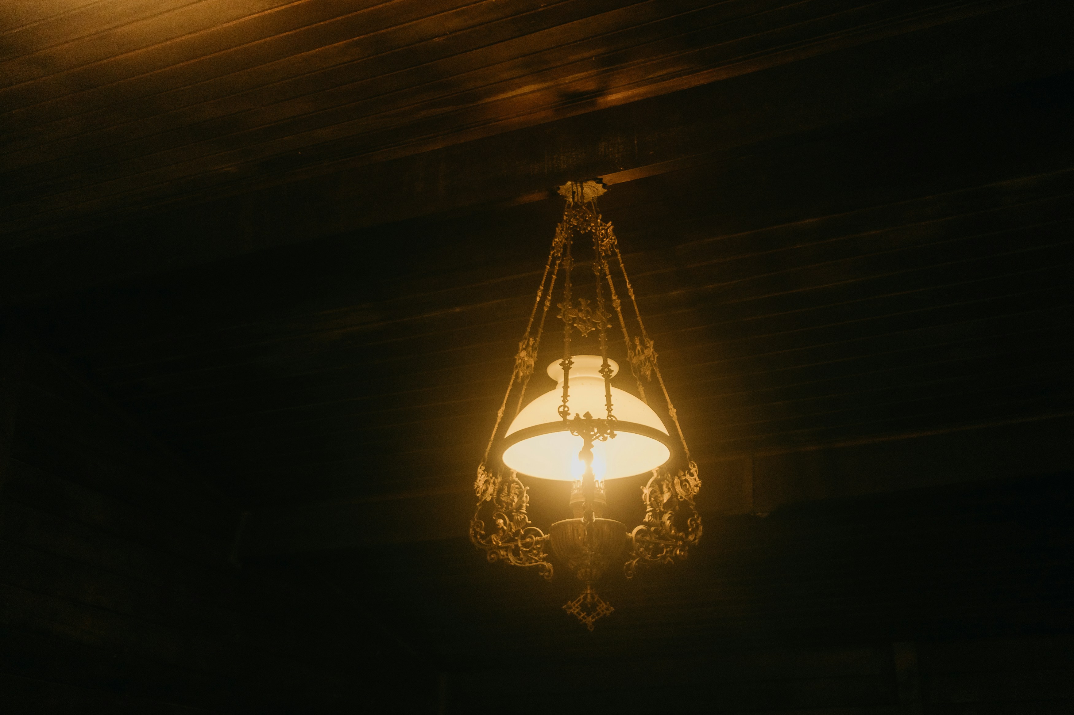 Dim Antique Chandelier in a Darkened Ceiling Vault