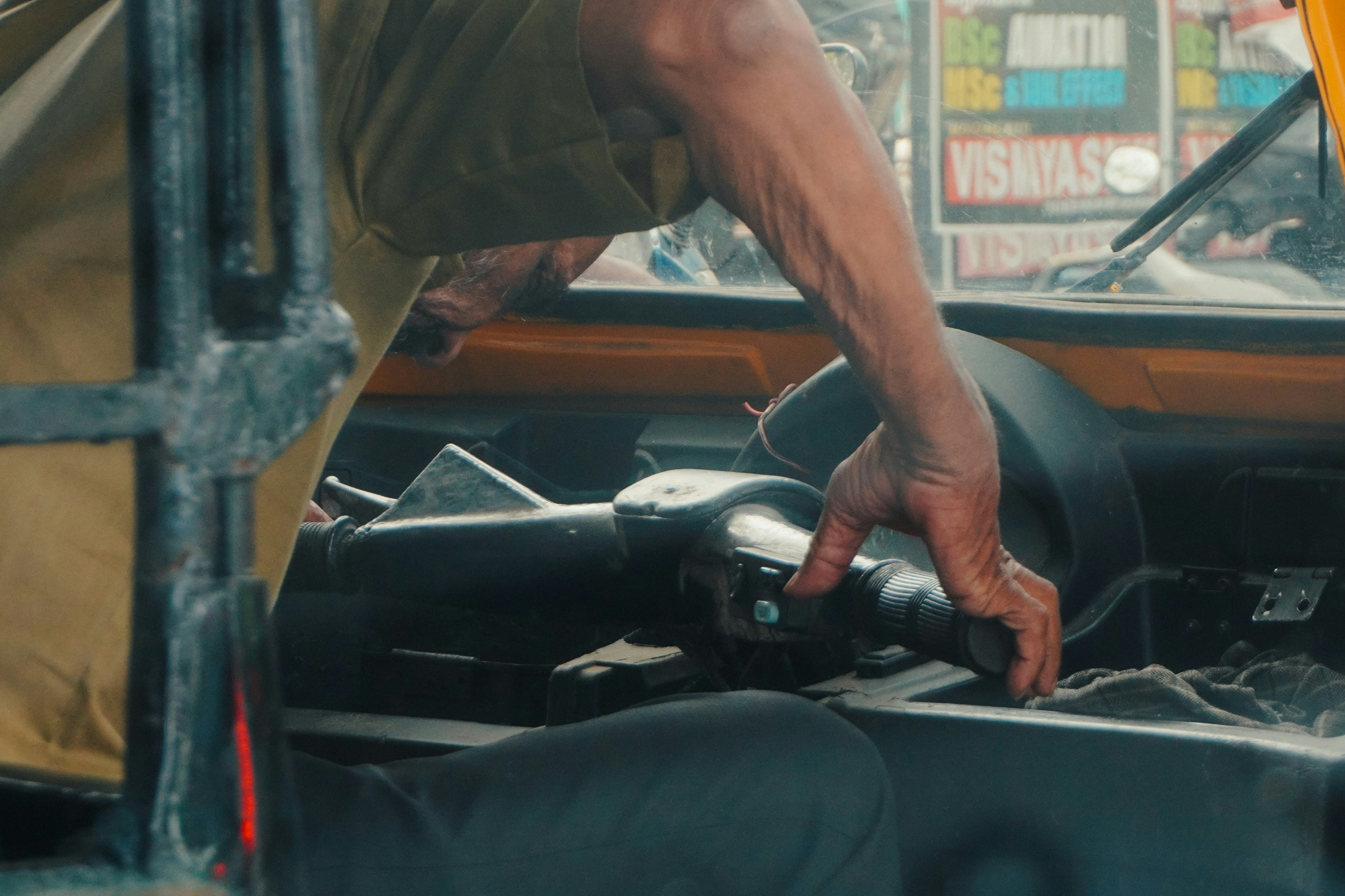 Hands in Focus: A Mechanic’s Grip on the Car’s Heart