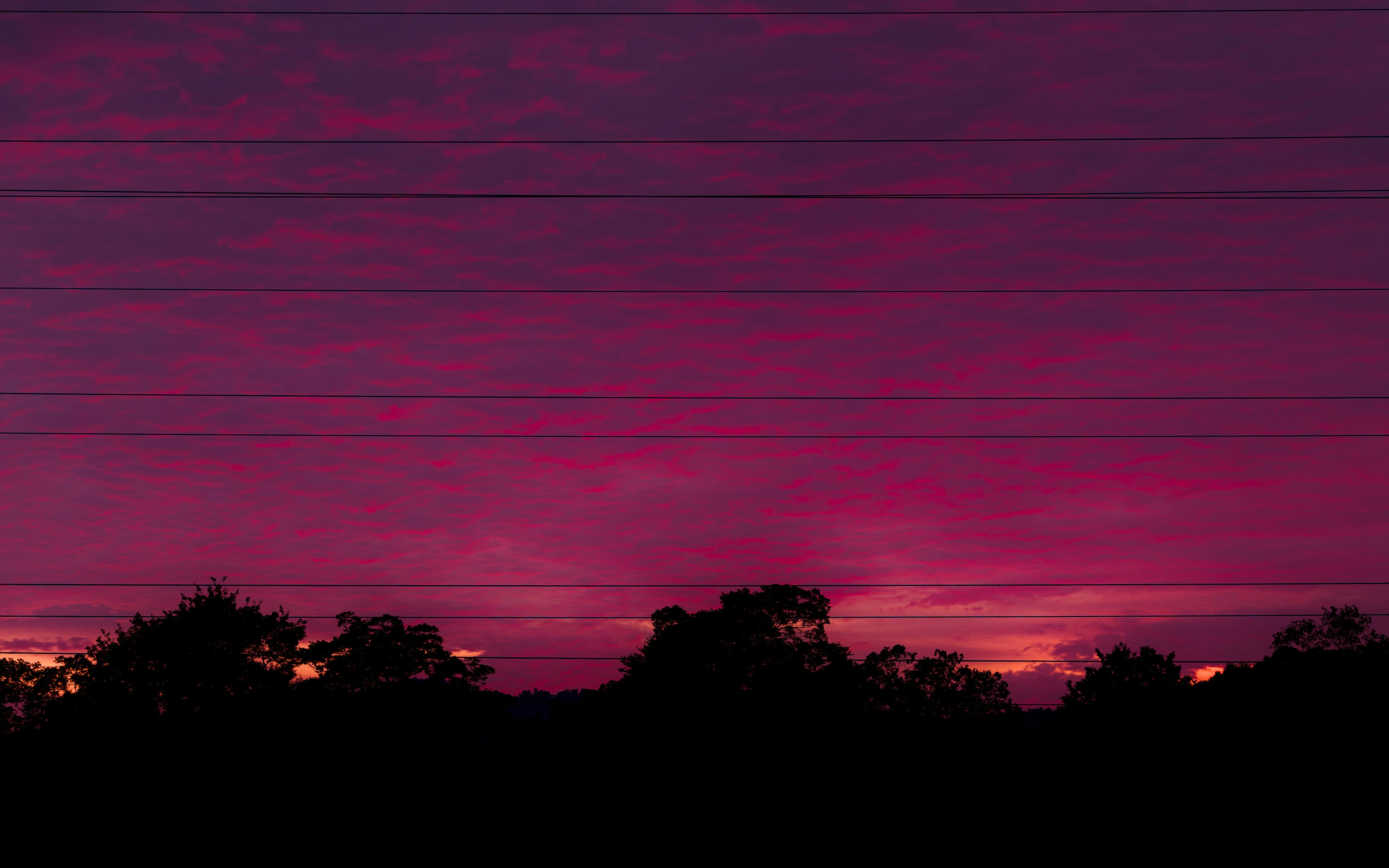 Horizon Ember: Twilight Silhouette Over Quiet Landscape