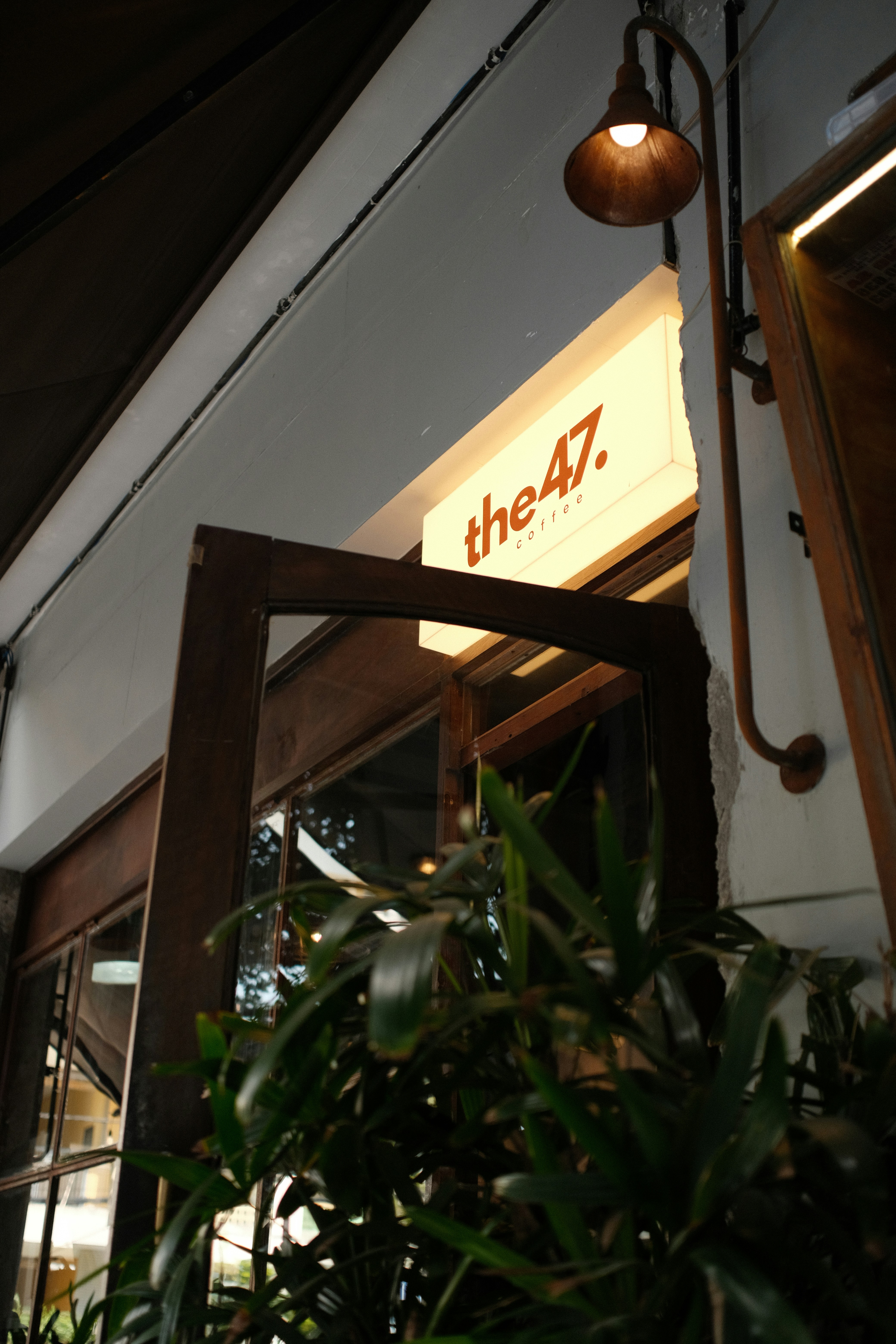 Entrance Glow: The 47 Sign Illuminates a Quiet Corner