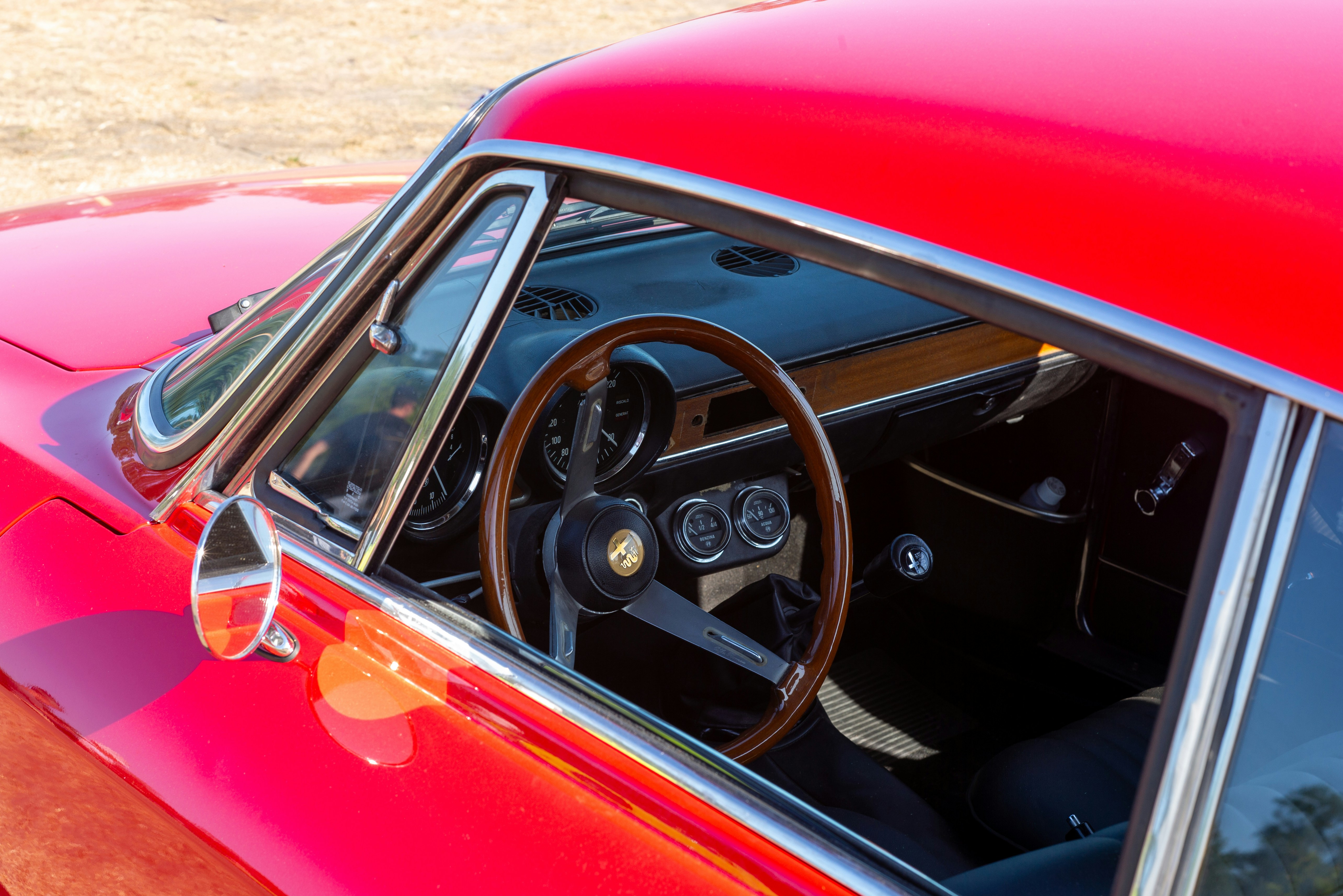 Crimson Cab: A Classic Cockpit Framed Through A Bottled Window