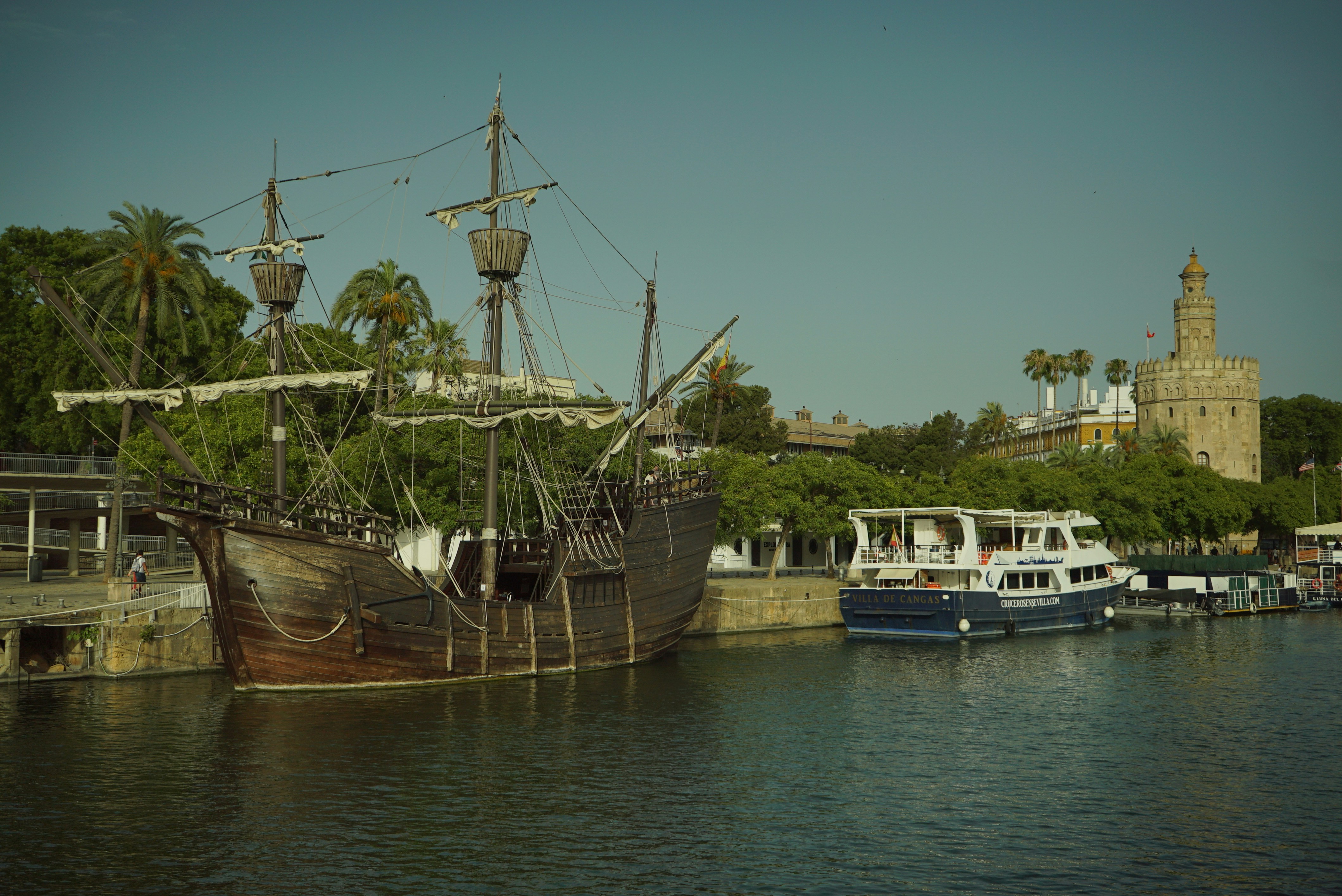 Tall Ship at the Quay: Historic Vessel Anchored by a Modern Waterfront