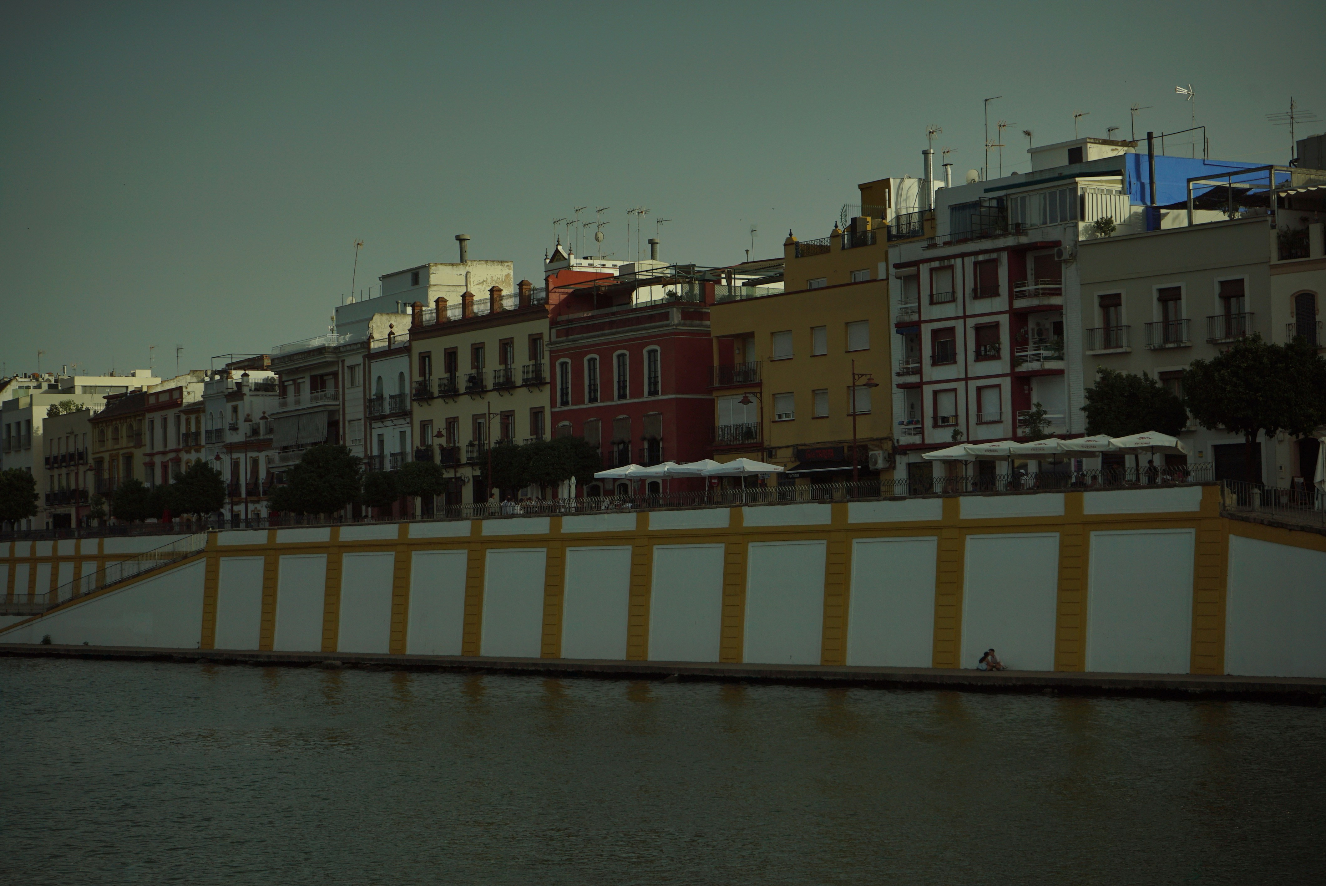 Colorful Seafront Row: A Quiet Waterfront of Painted Townhouses