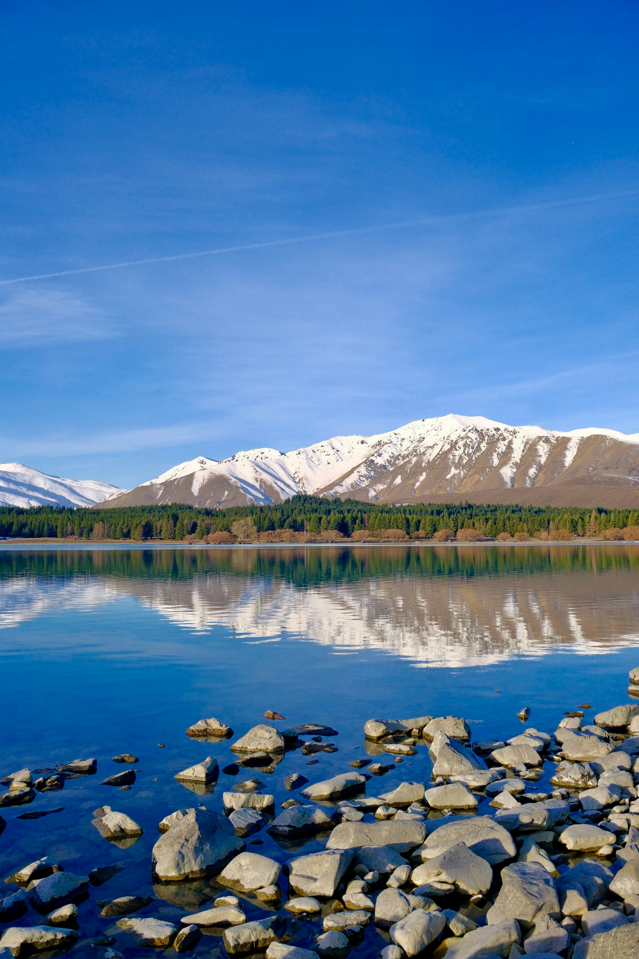 Snow-kissed Peaks over a Glassy Lake
