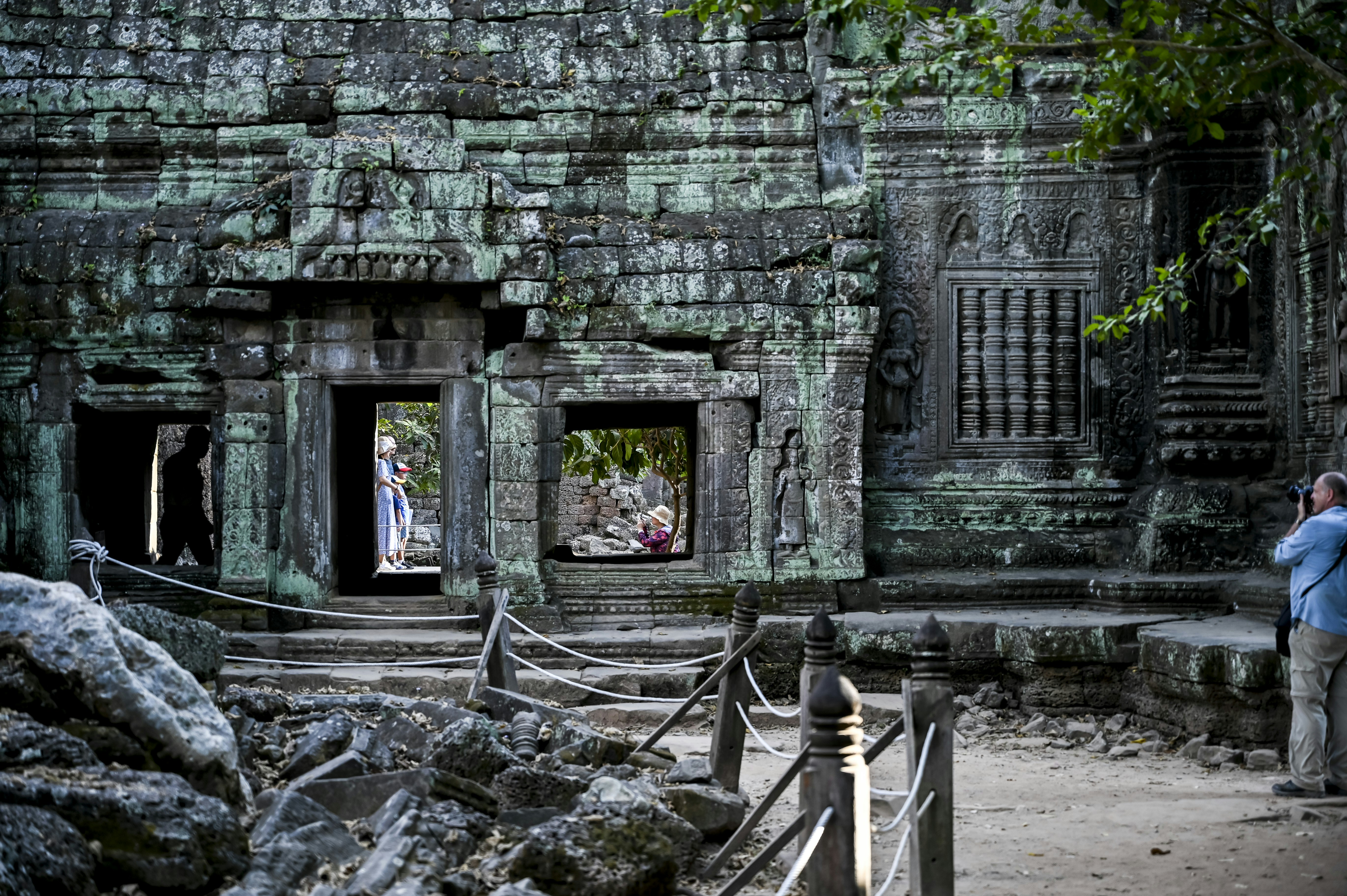 Through the Gate: A Silhouette in the Stone Corridor