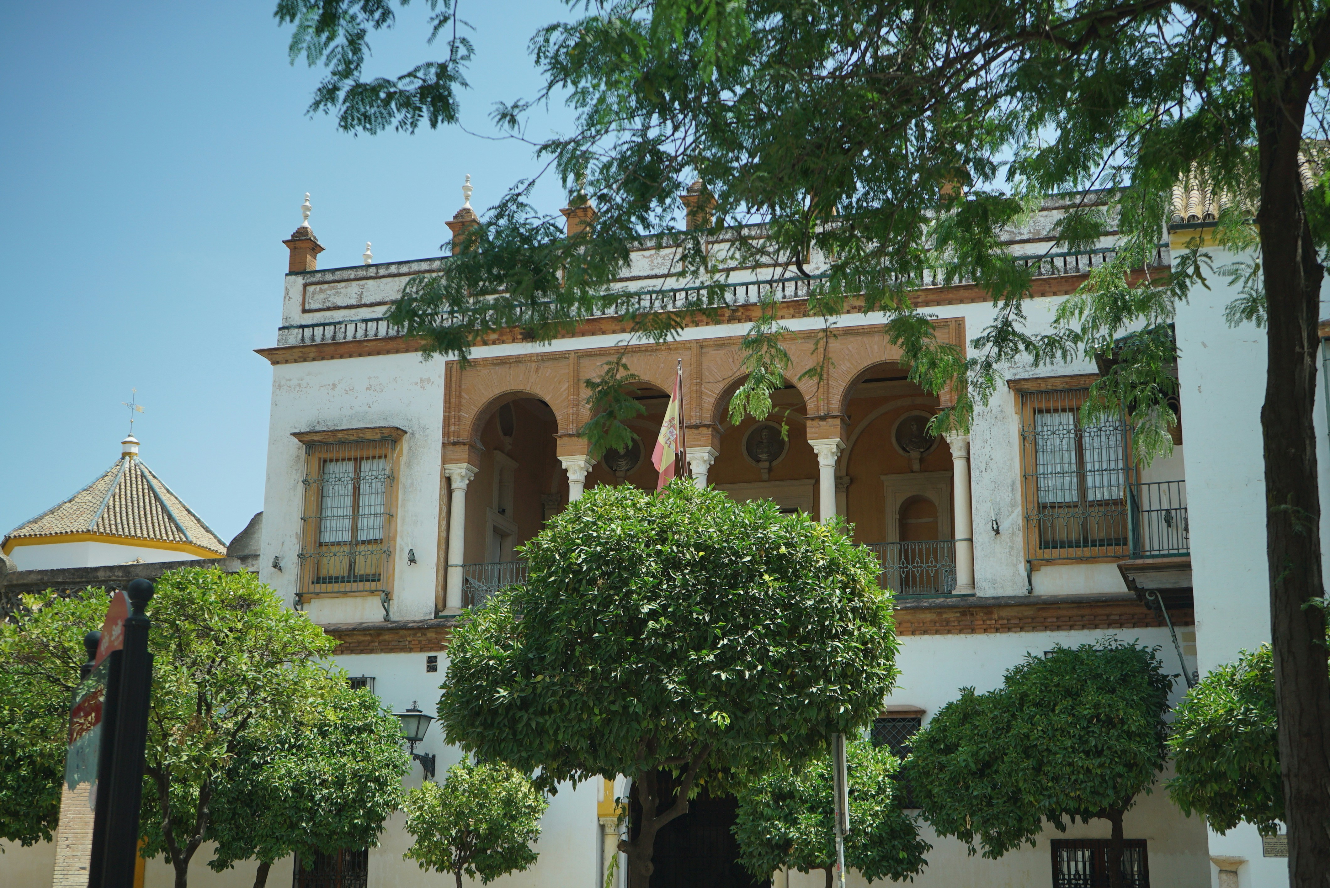 Arched Balcony of a Sunlit Heritage Courtyard