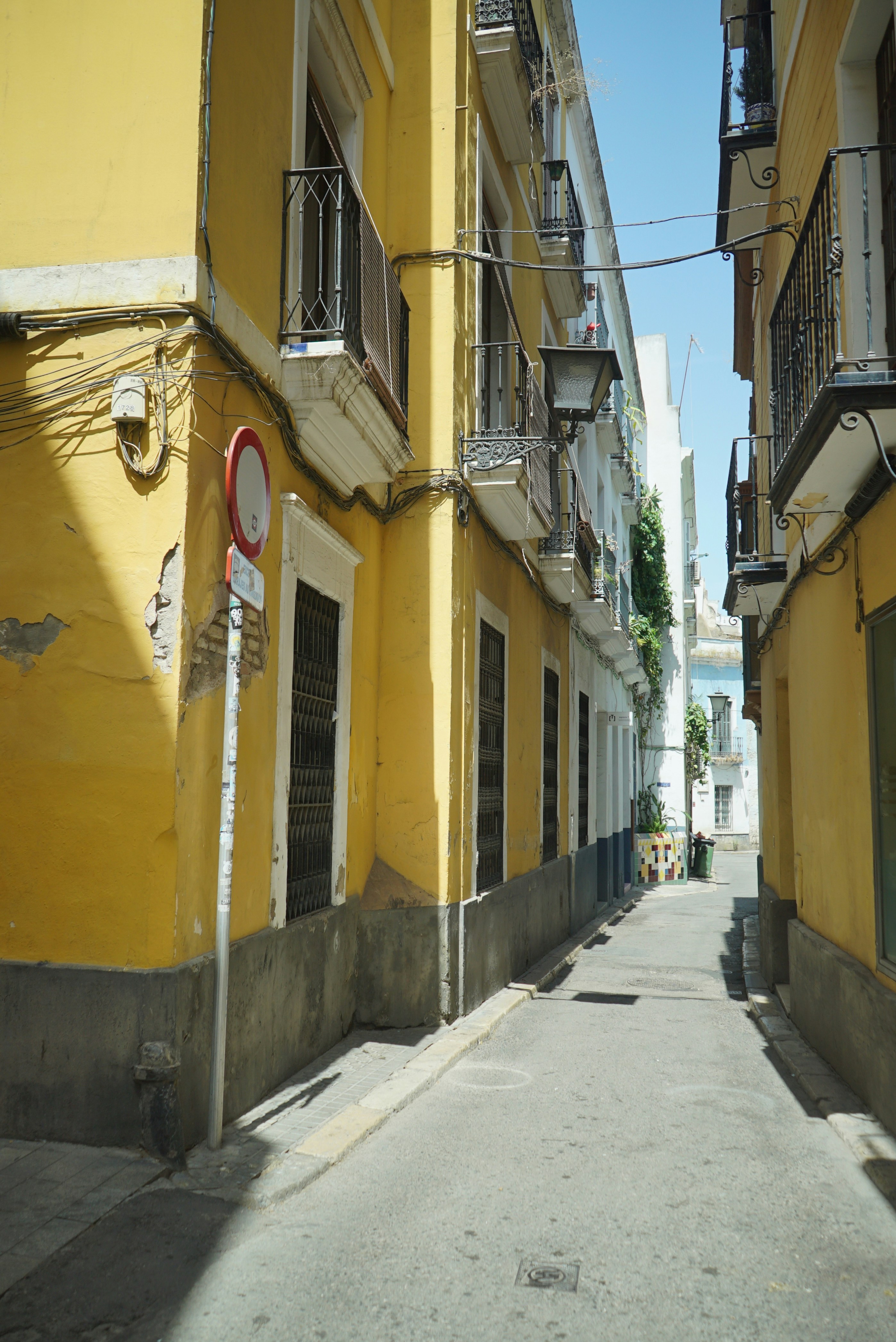 Calle Amarilla: Narrow Alley Between Sunlit Facades