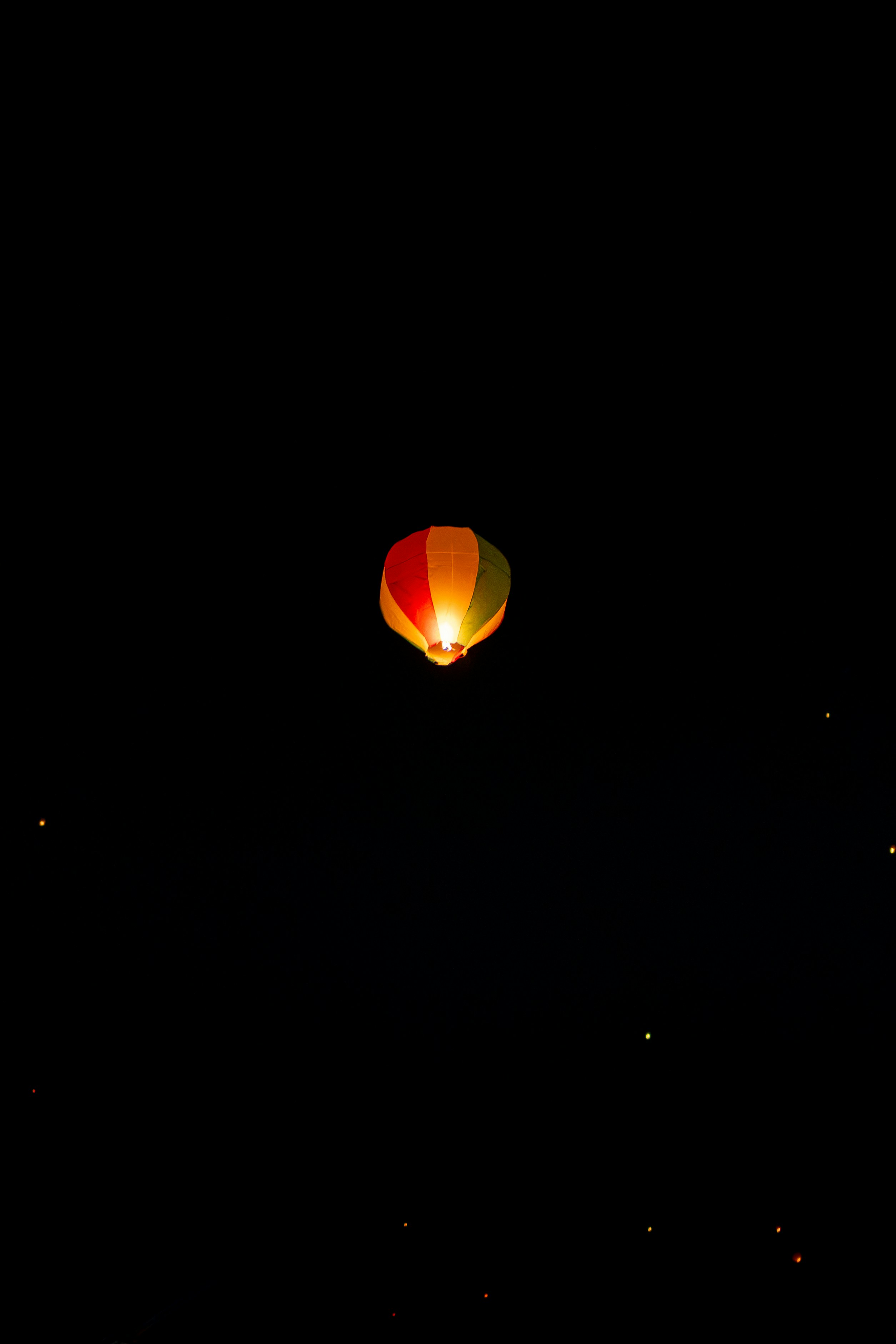 Night Sky Balloon: A Single Flame of Color in the Vast Dark