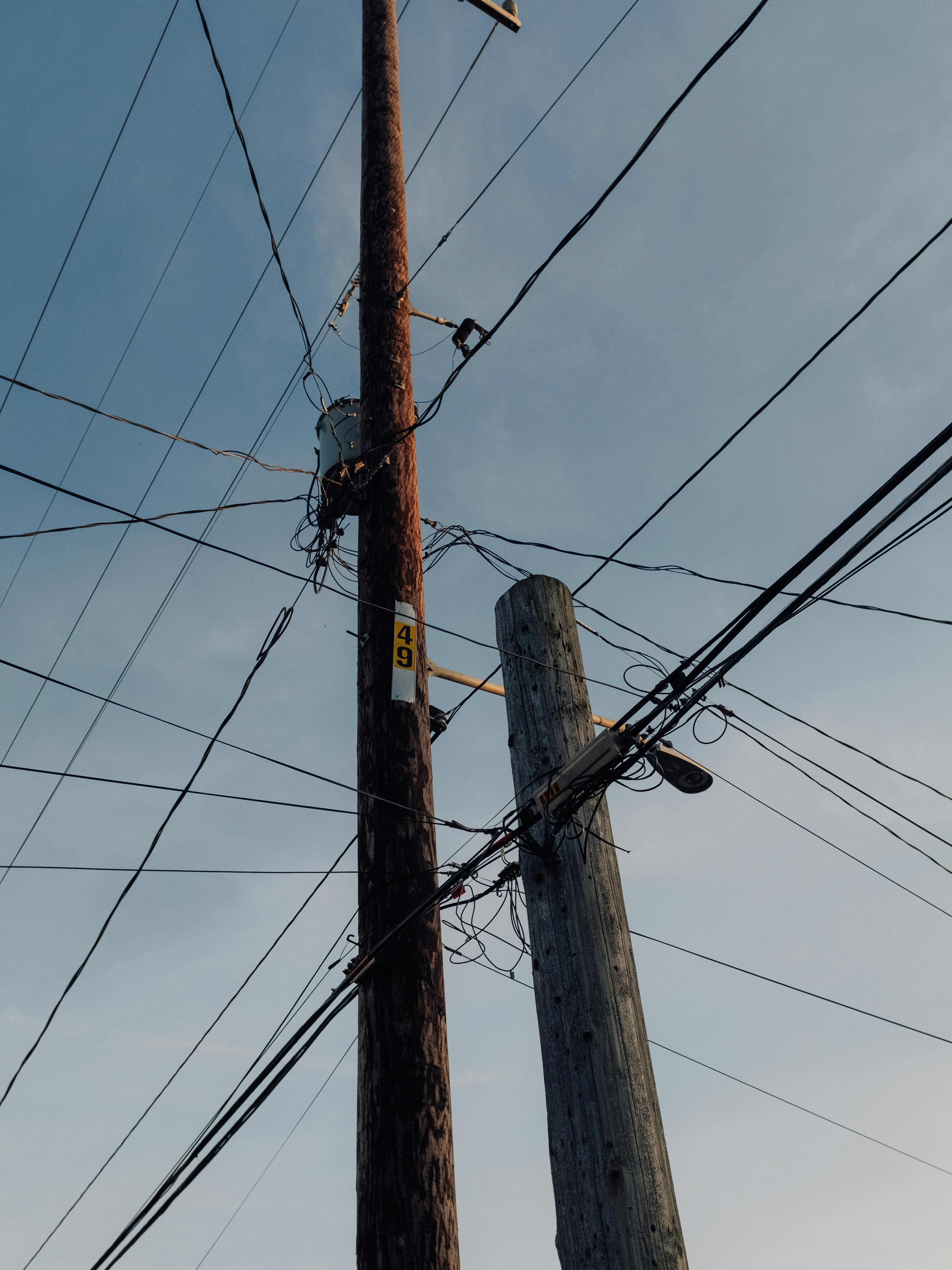Crossed Lines: Utility Poles Against a Quiet Sky