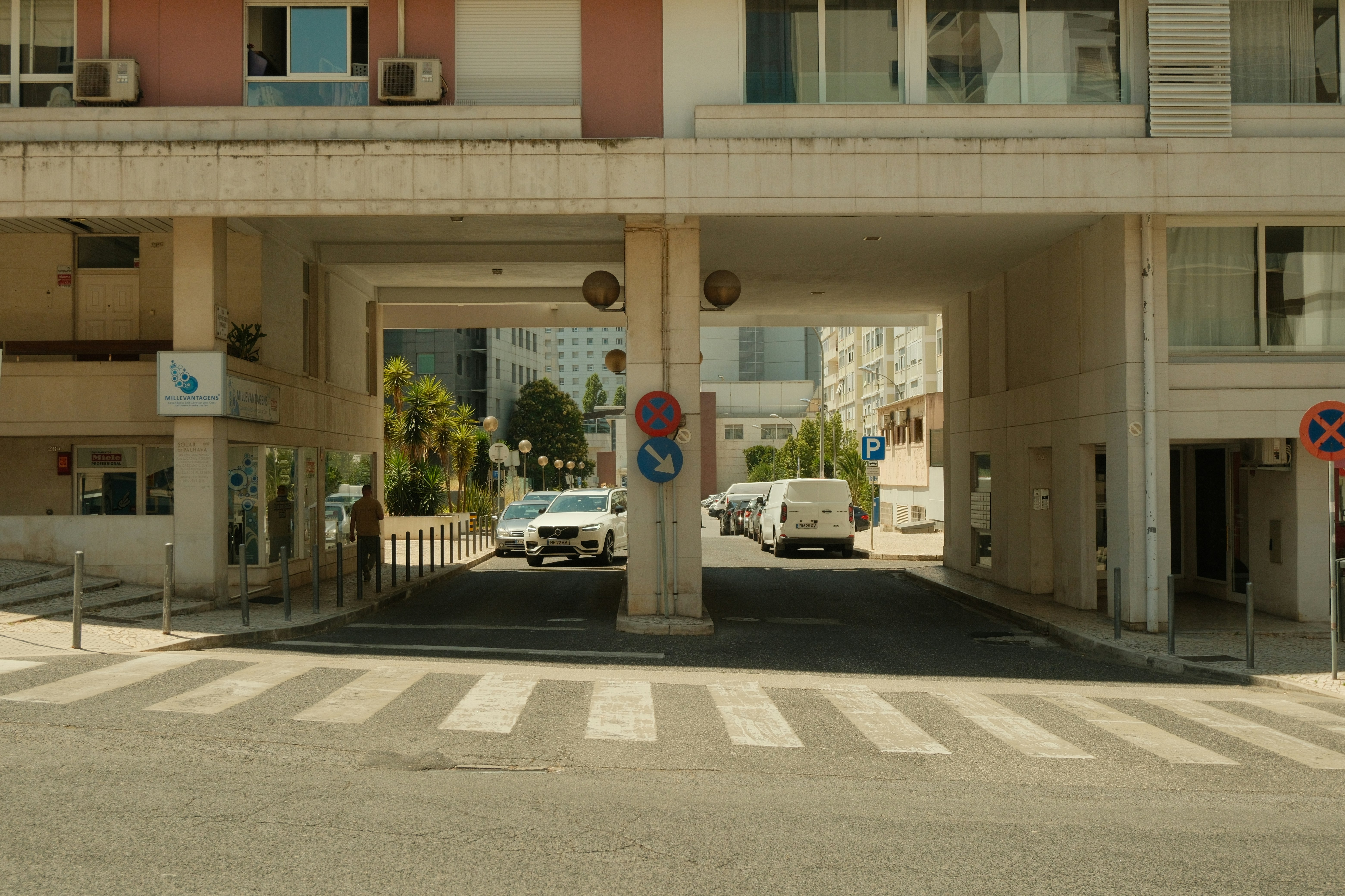 Underpass Corridor: Street Scene Framed by Concrete Atria