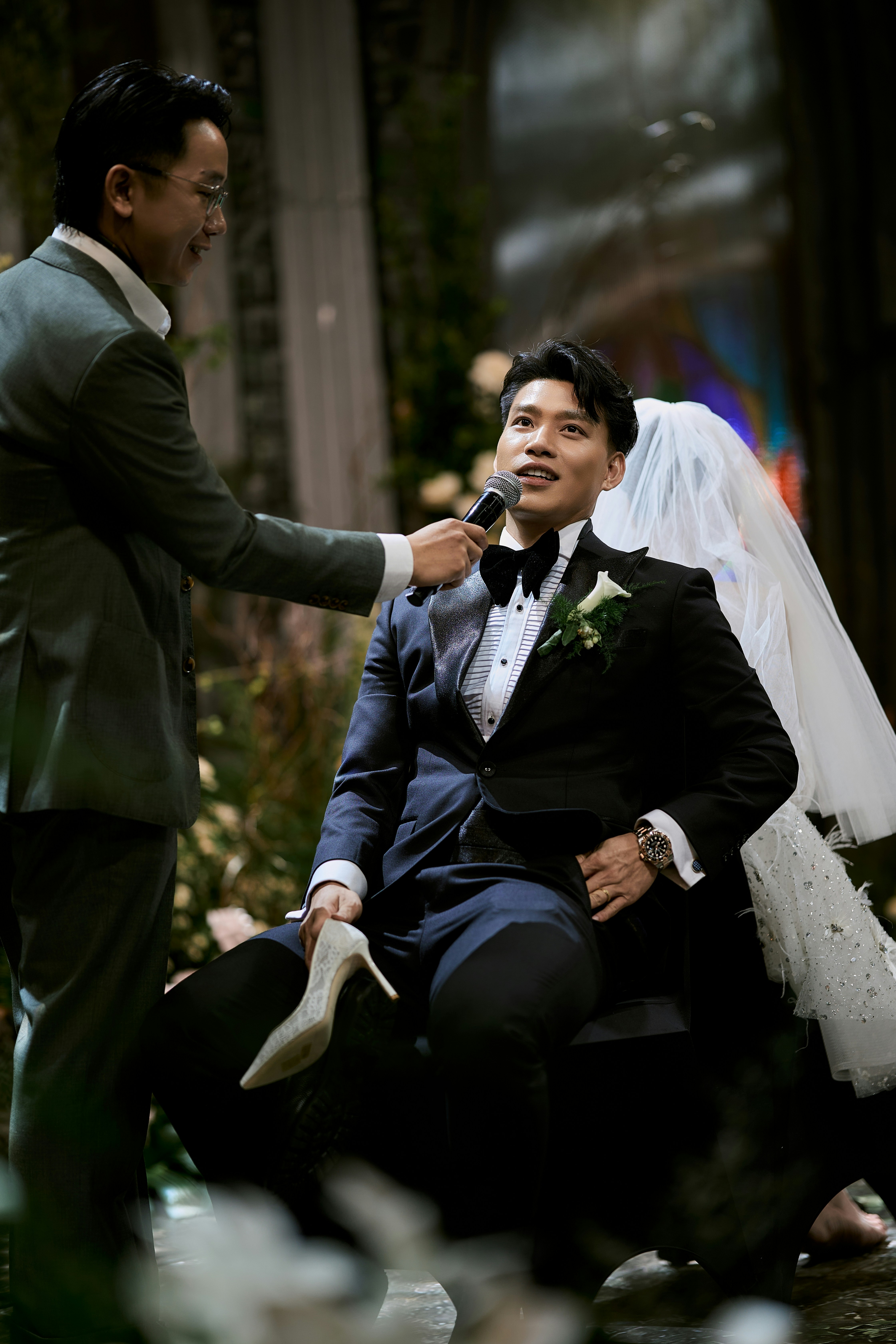 The Toast and the Promise: Groom's Quiet Confidence on the Veranda Stage