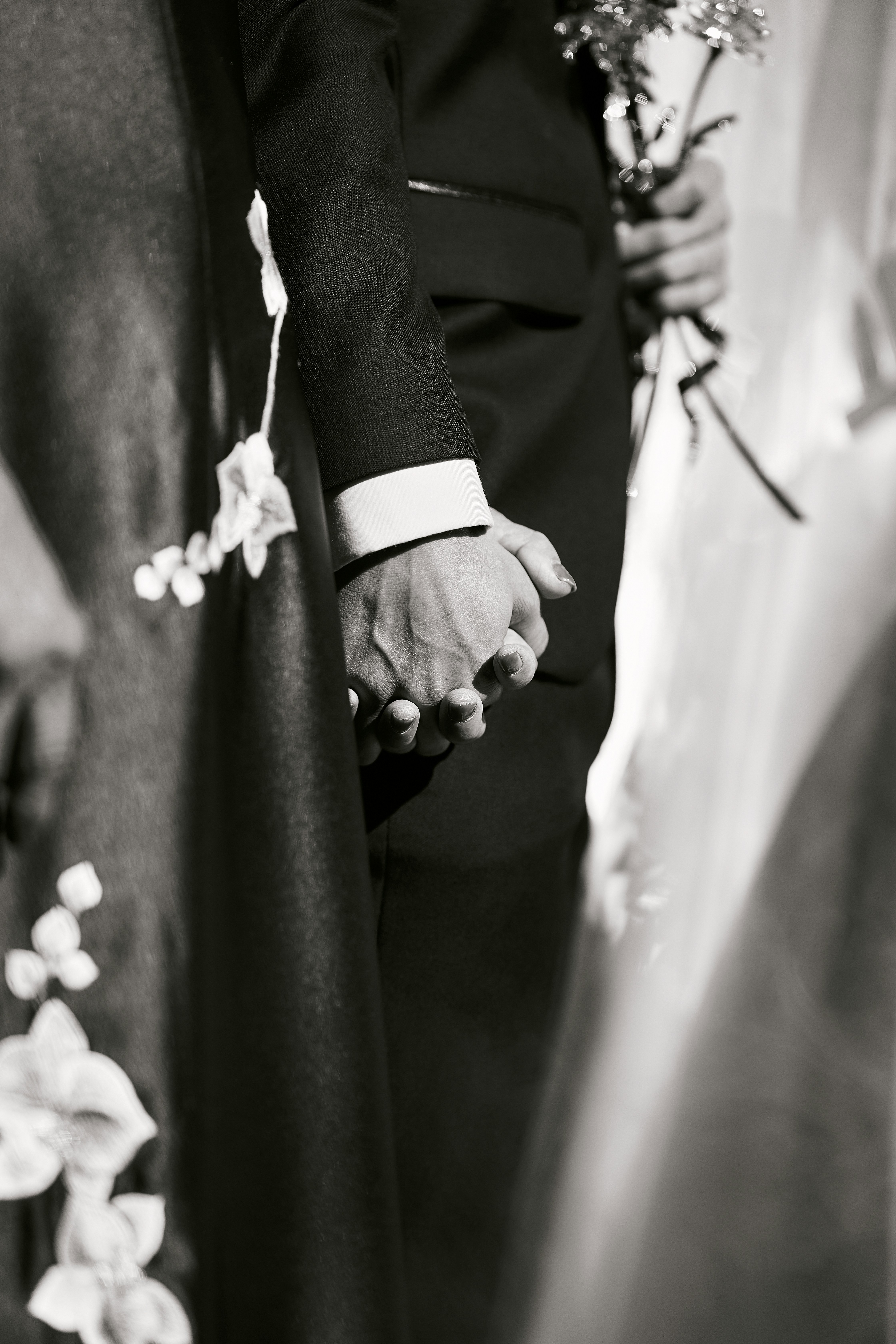 Holding On: A Quiet Moment Between Hands at the Vows