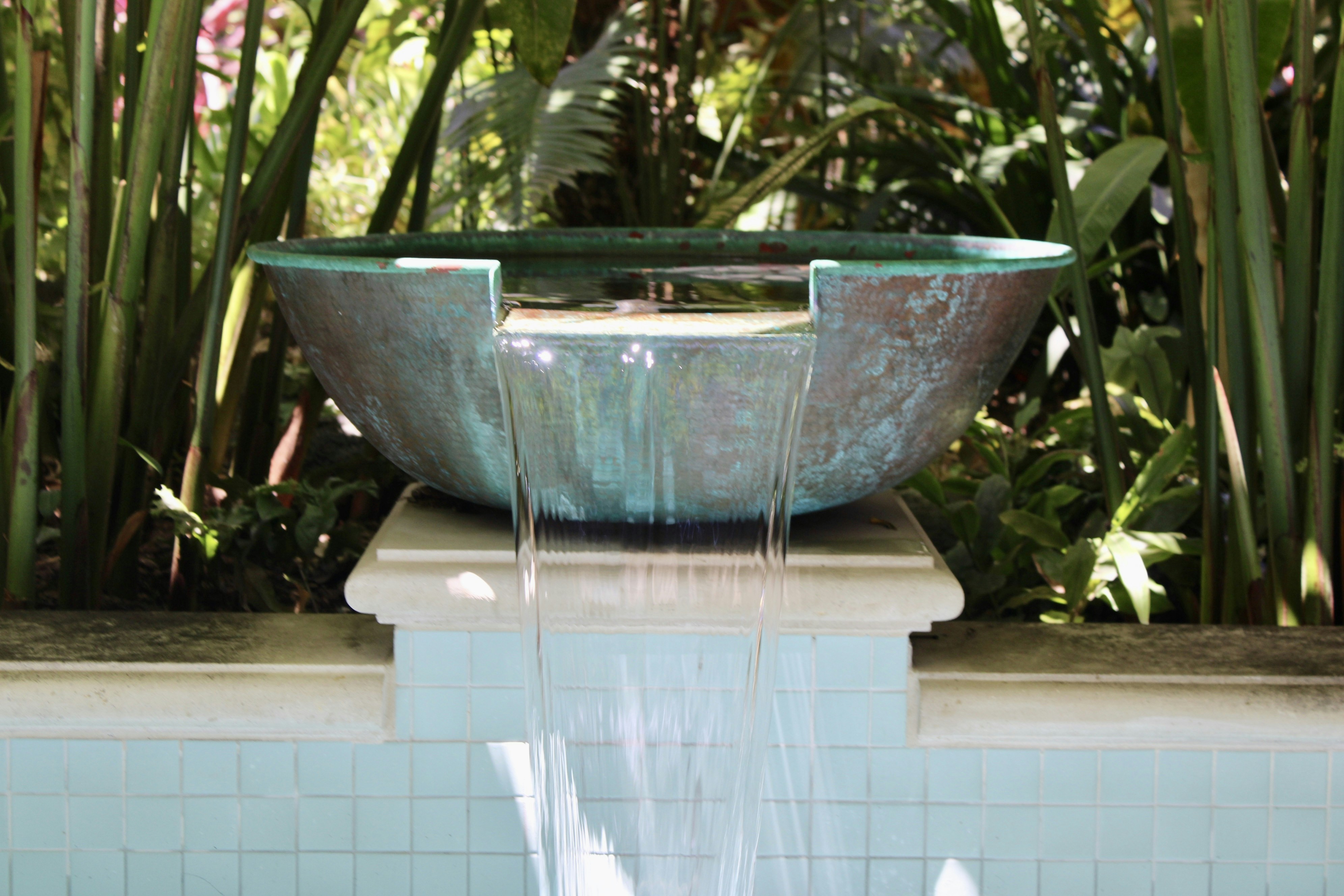 Cerulean Cascade: a copper bowl spills over into a tiled pool