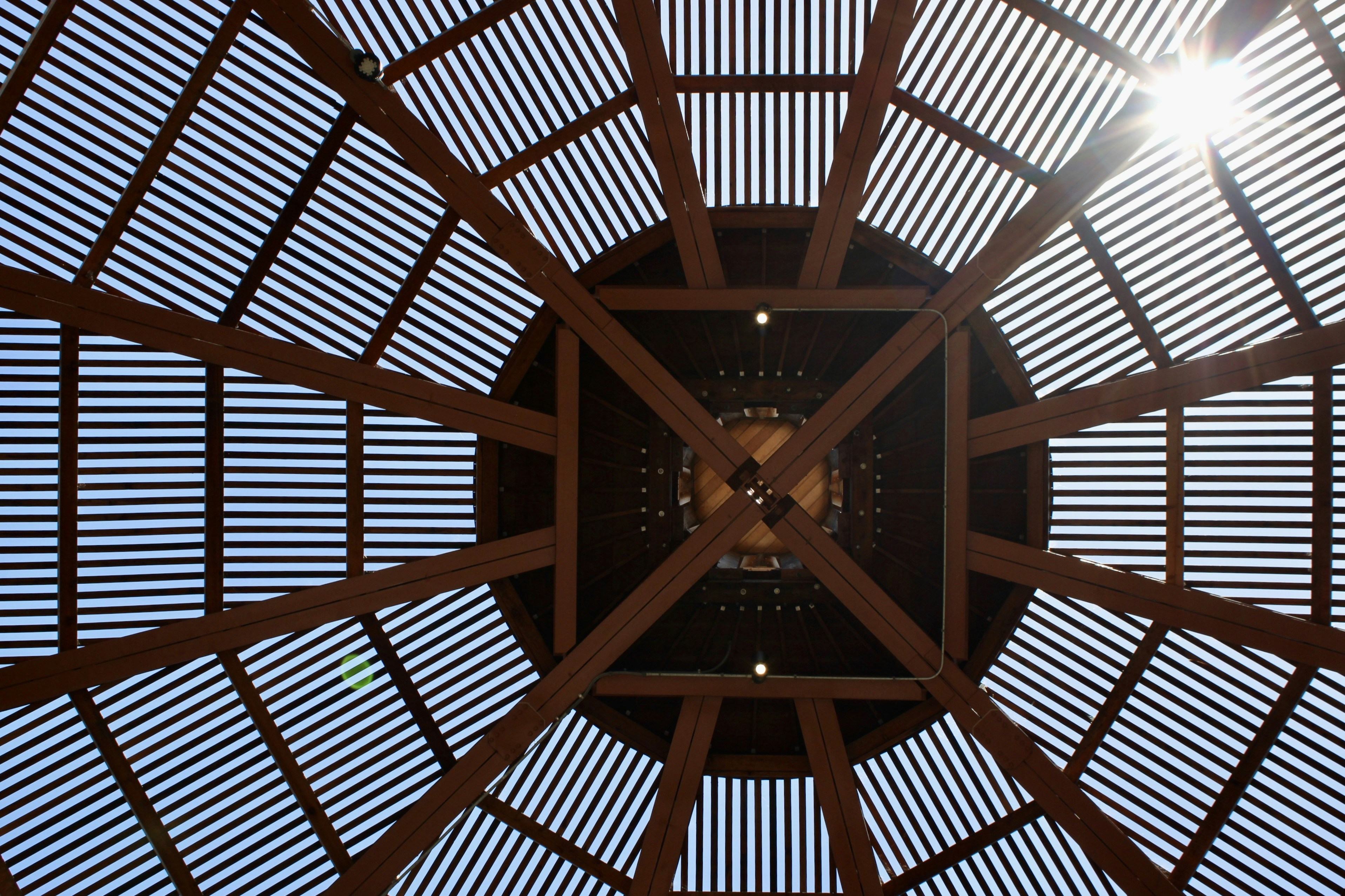 Crossed Wooden Spokes: Beneath the Circular Roof