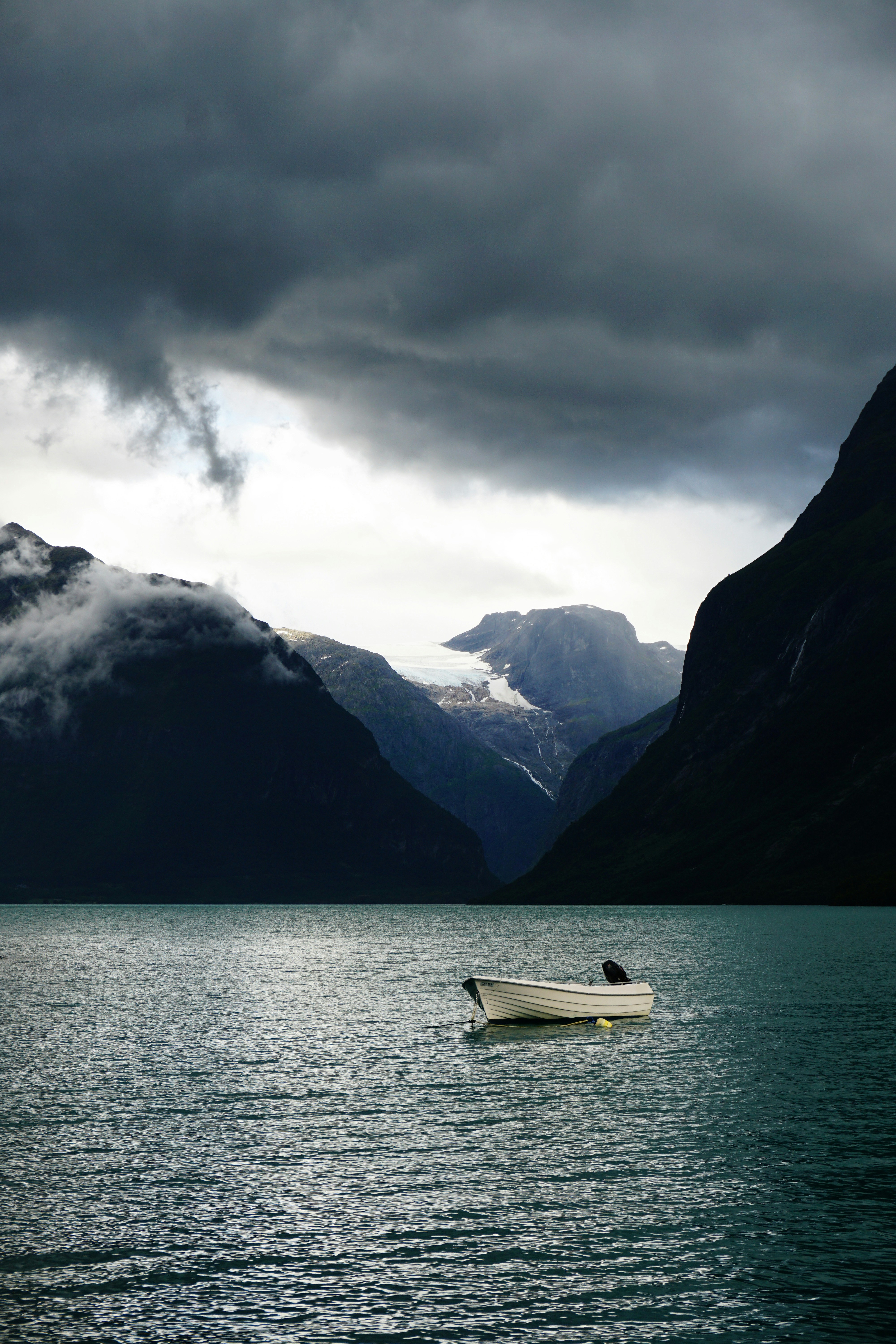 Moonlit Fjord: Lone Boat on Crying Waters
