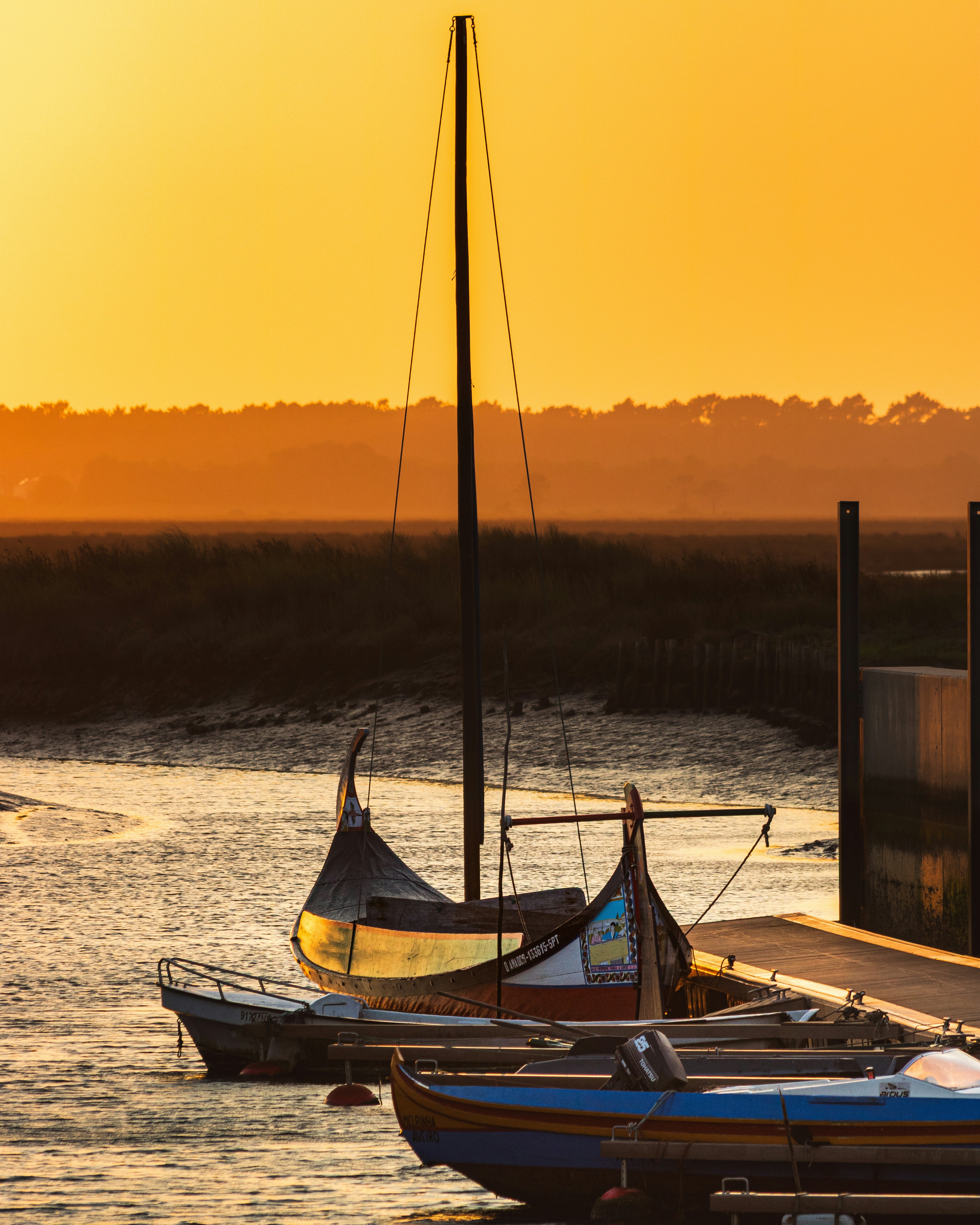 Golden Hour at the Tide Gate: Boats Rest on a Quiet Channel