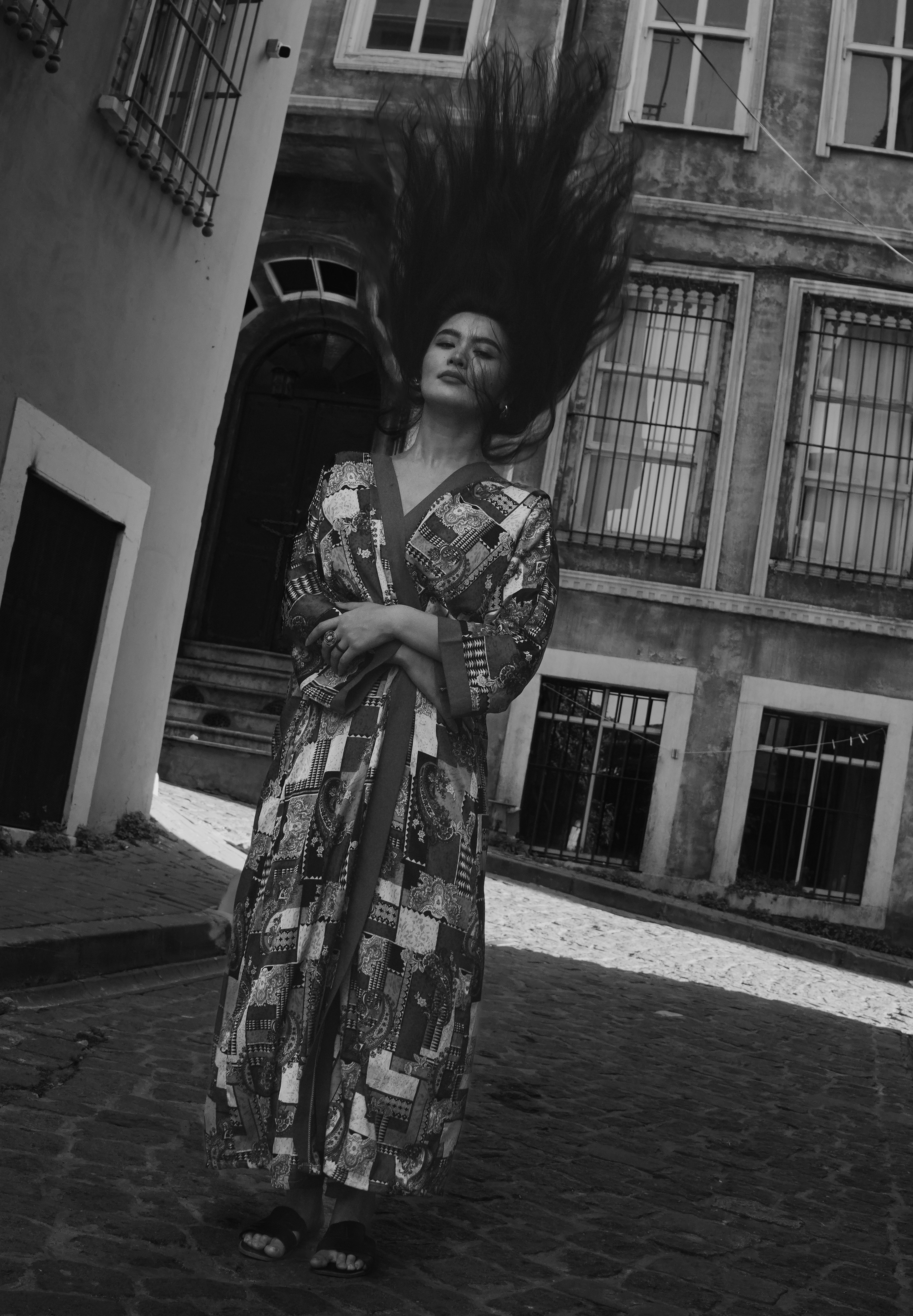 Shadowed Elegance in a Quiet Cobblestone Street