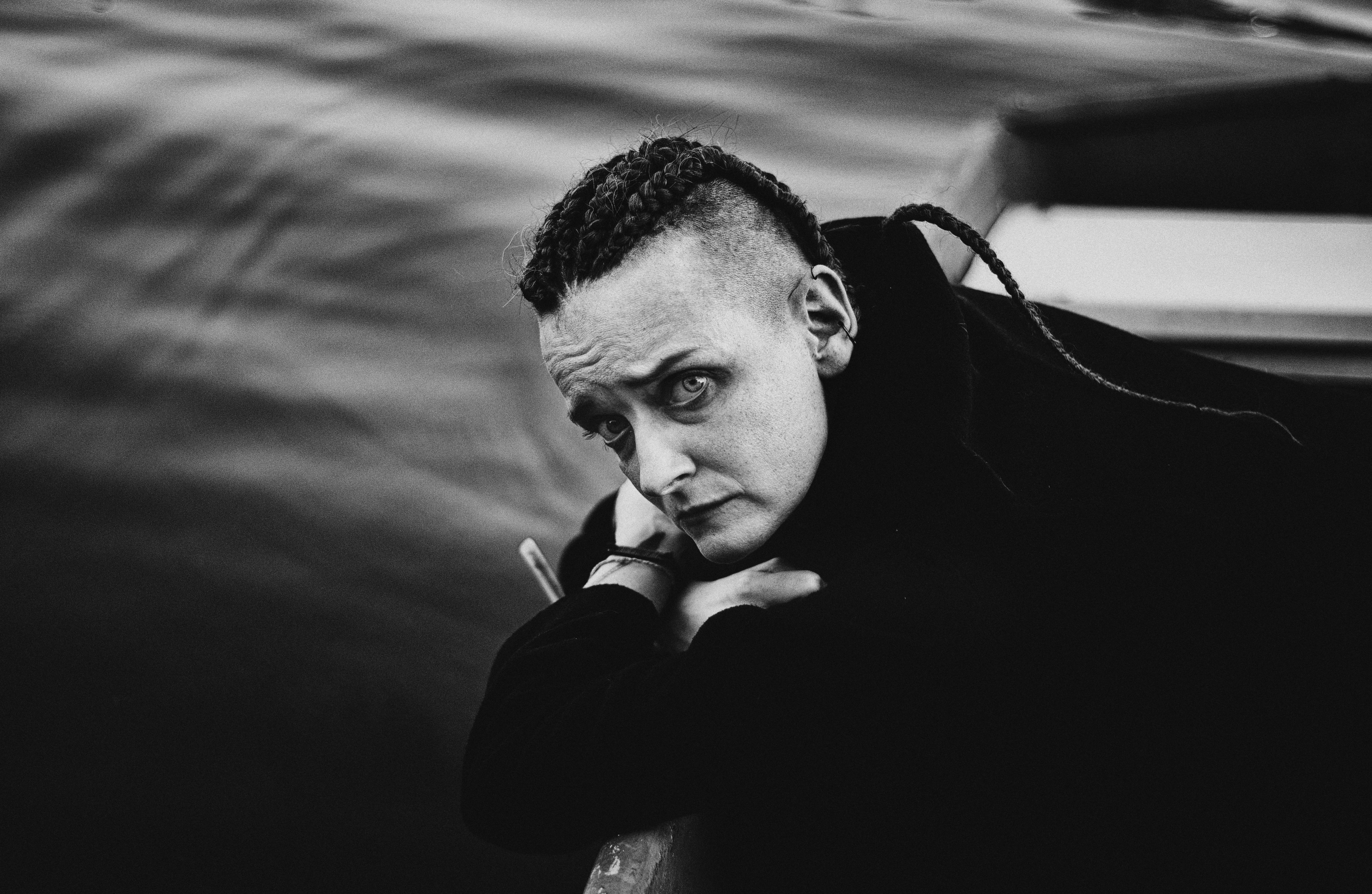 Eyes on the Edge: A Gritty Black-and-White Moment on the Water