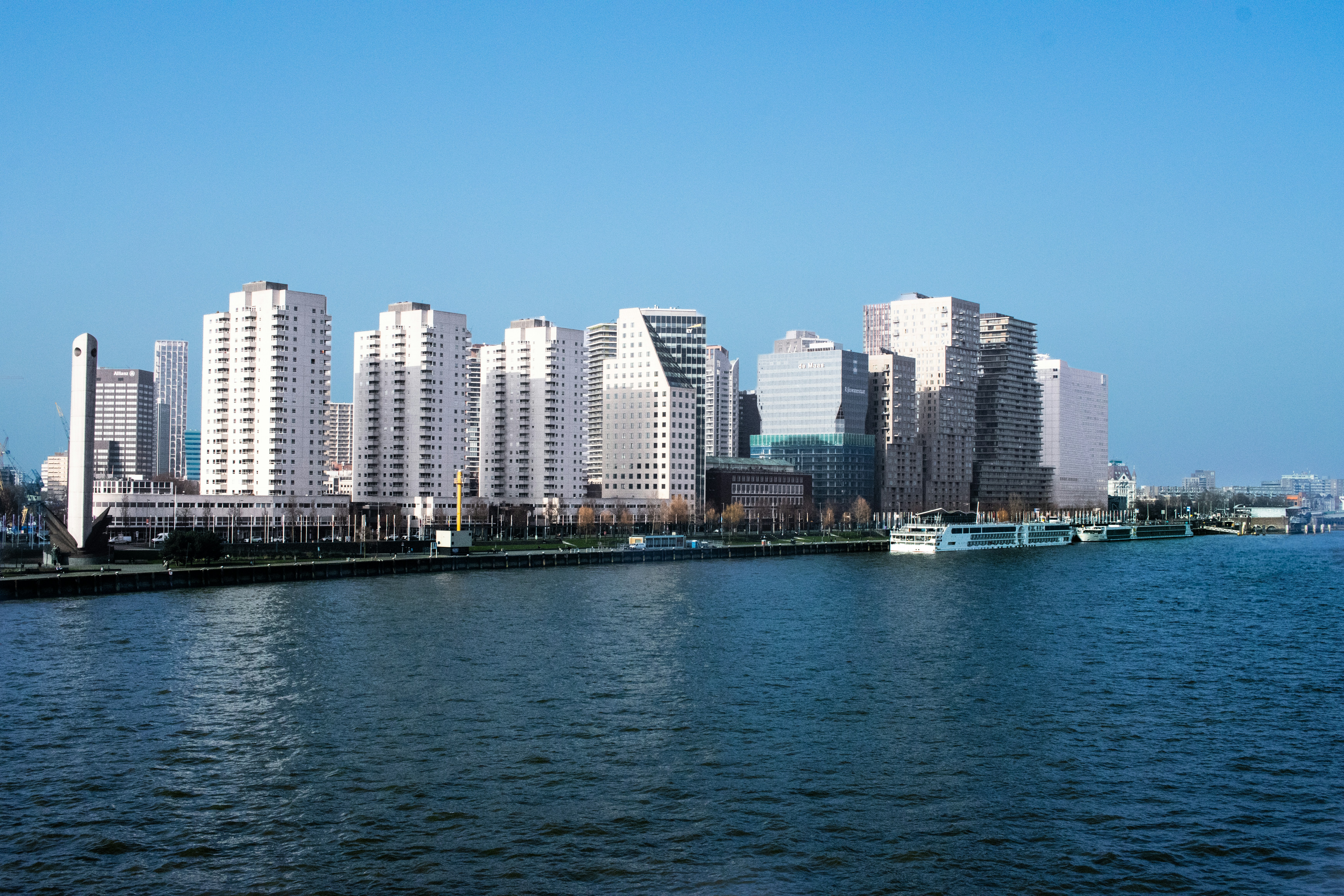 Harbor Horizon: Modern Urban Silhouette Along a Calm Waterfront