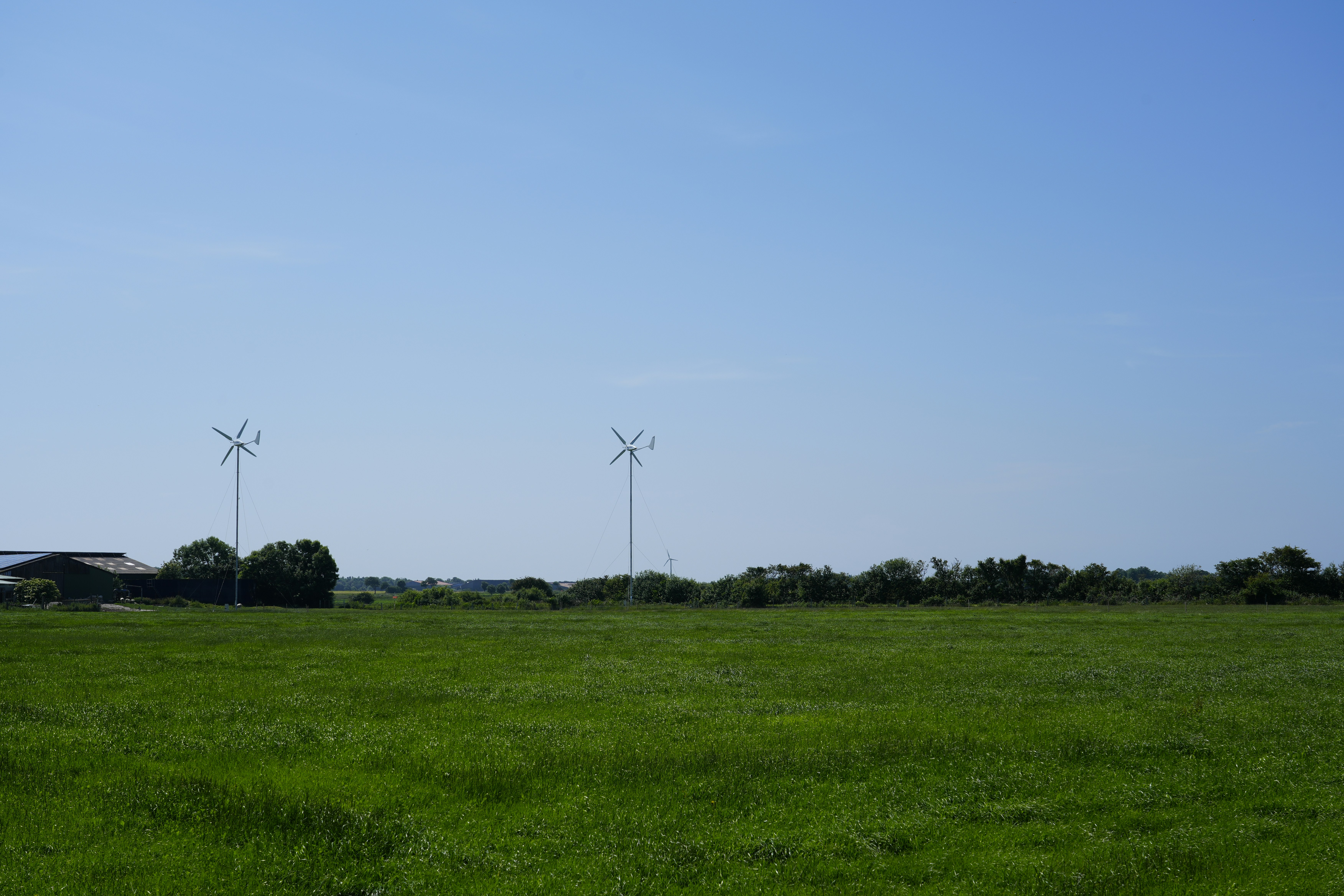 Wind Turbines on a Quiet Prairie at Noon