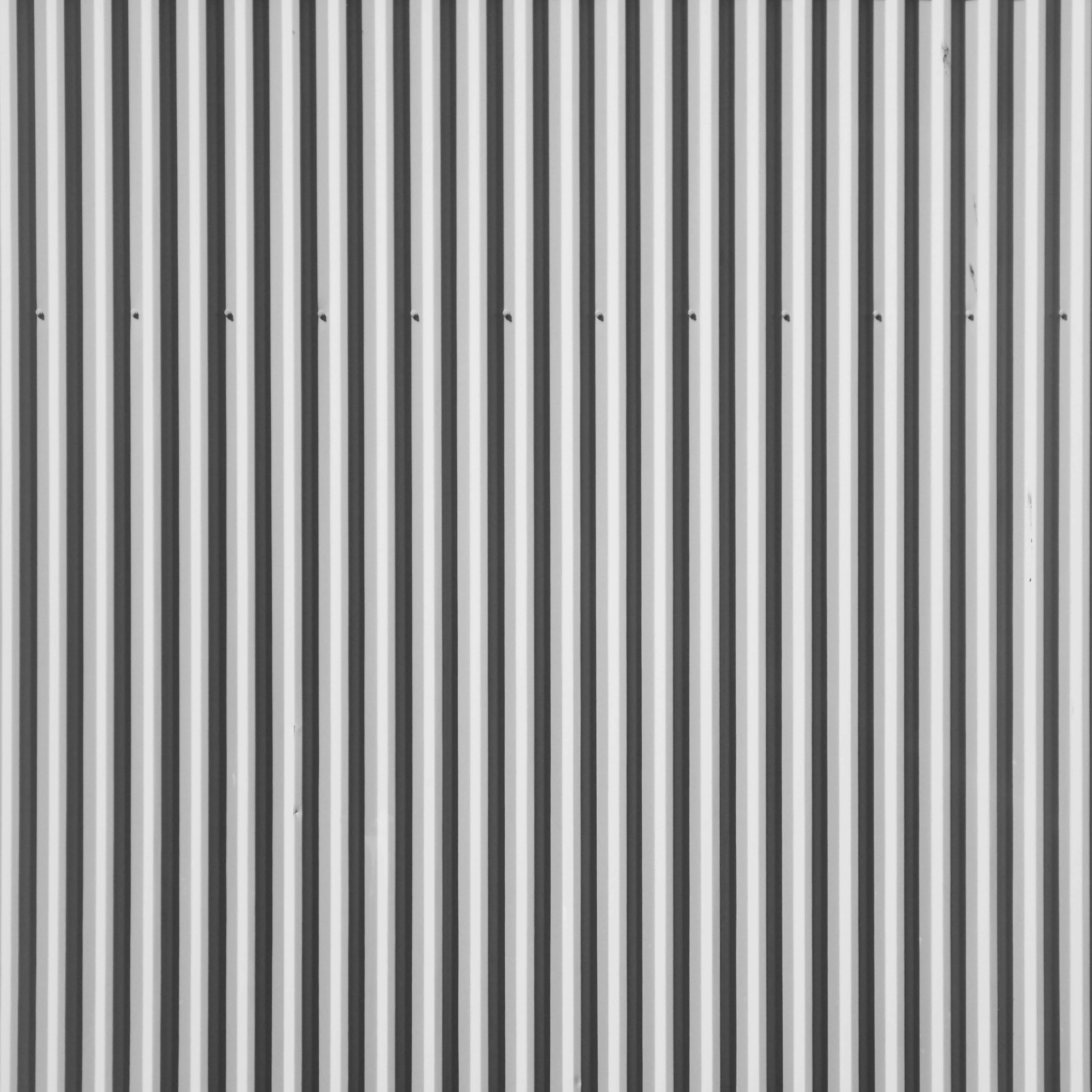 Rhythms of Steel: Vertical Stripes in Monochrome Light