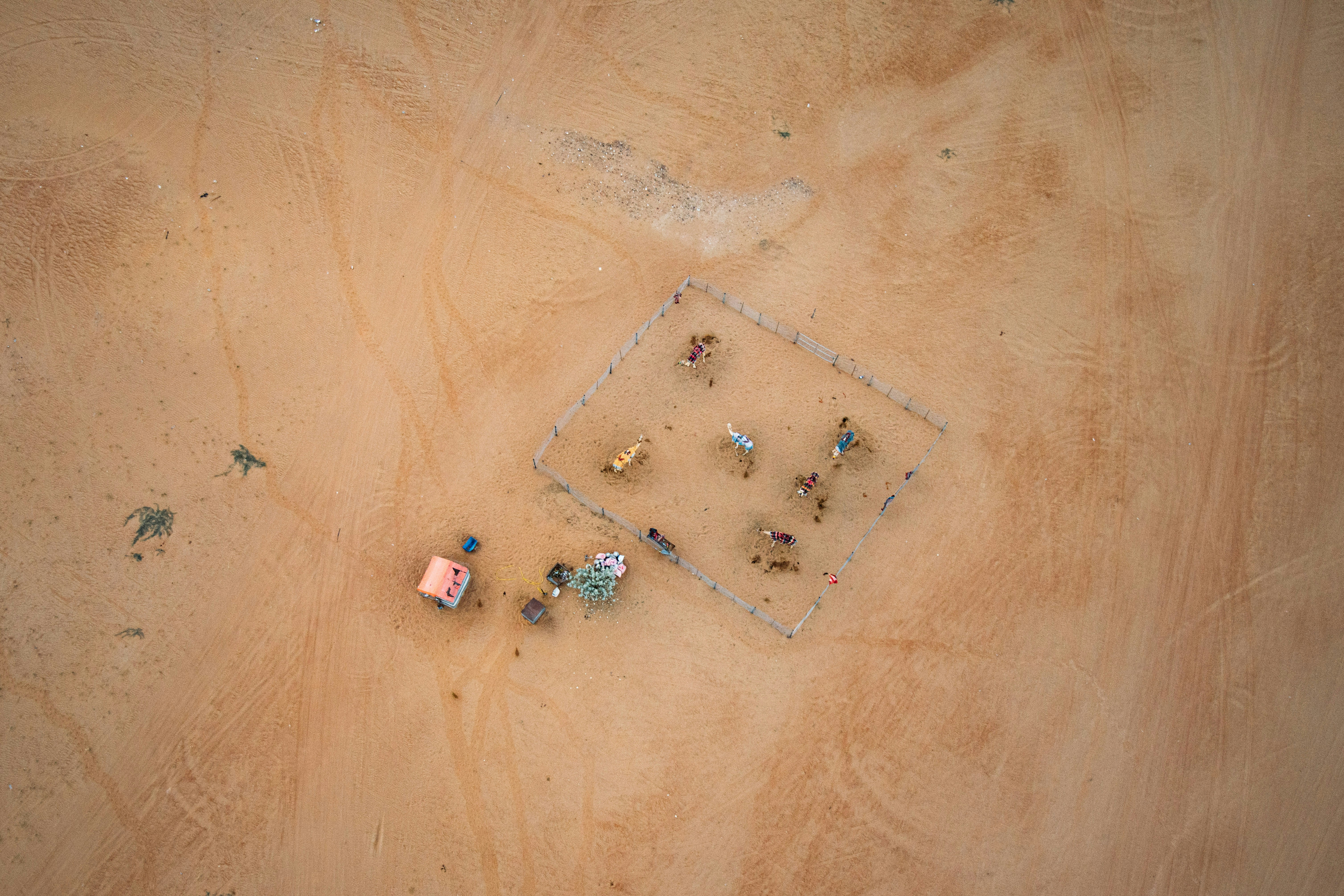 Aerial Blueprint: Farmstead at the Center of a Red Dust Canvas
