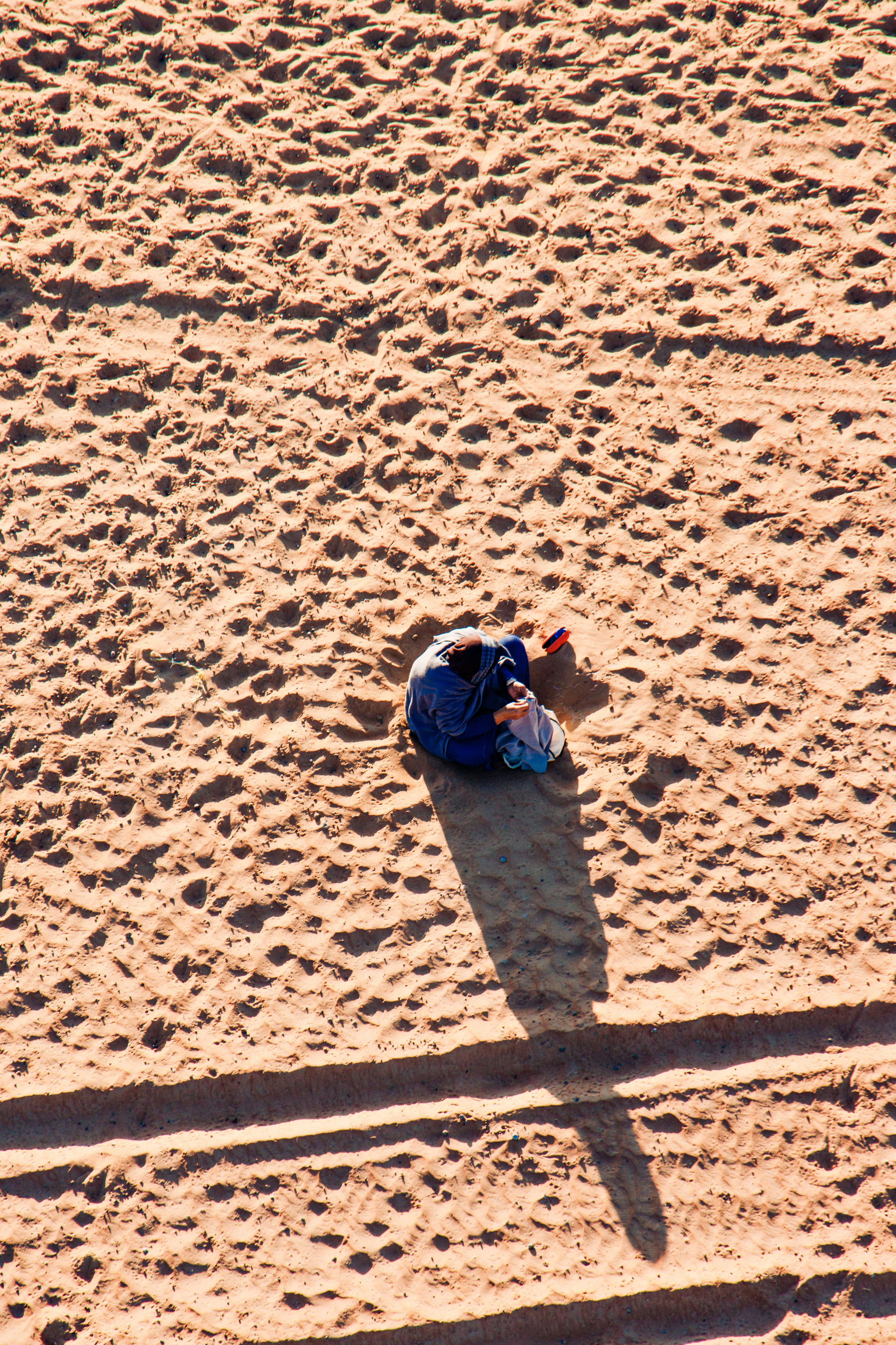 Solo in the Sand: A Distant Explorer and the Shadow Road