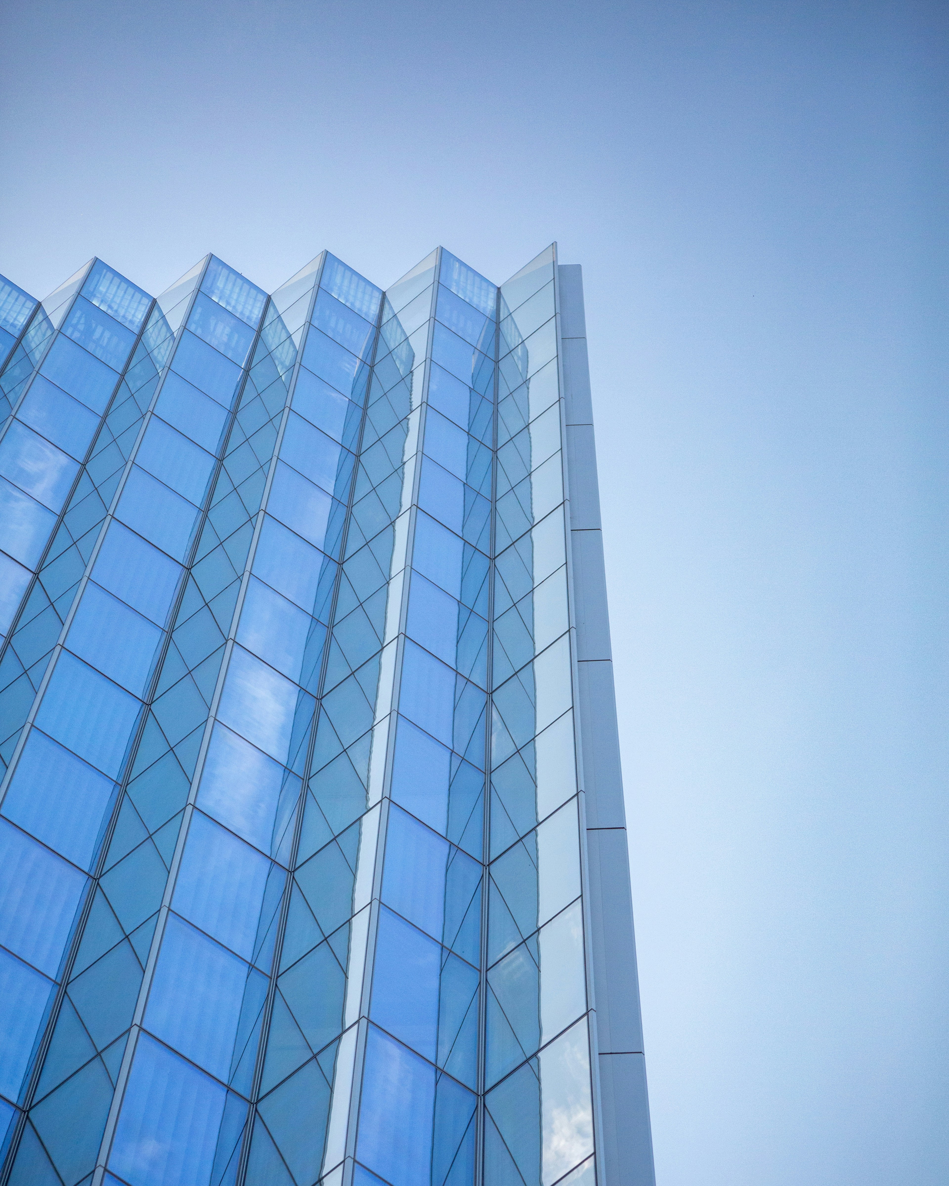 Blue Facets Reach Skyward: A Towering Glass Composition