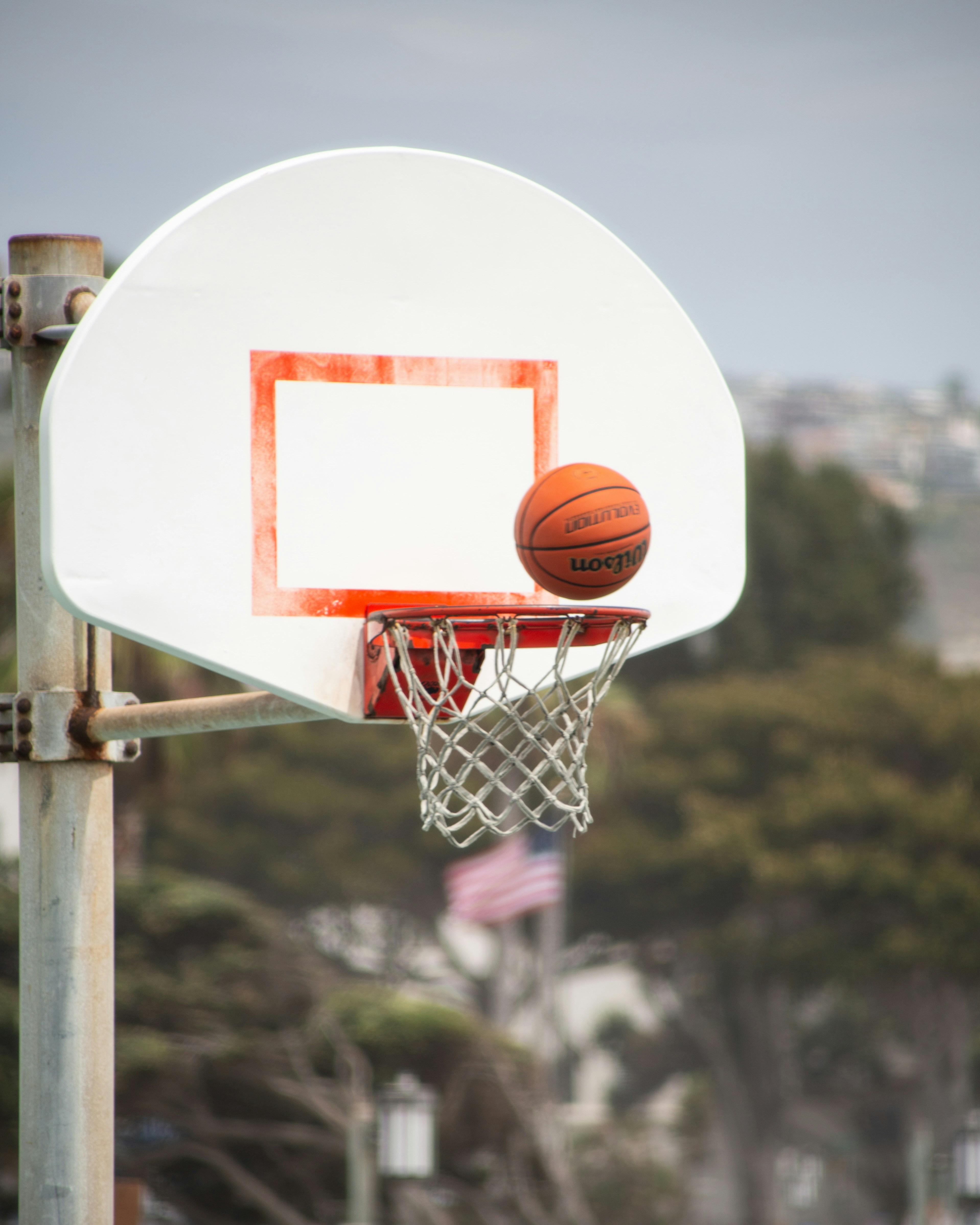 Basketball Hoop Close-Up: Ball Hovering at the Rim