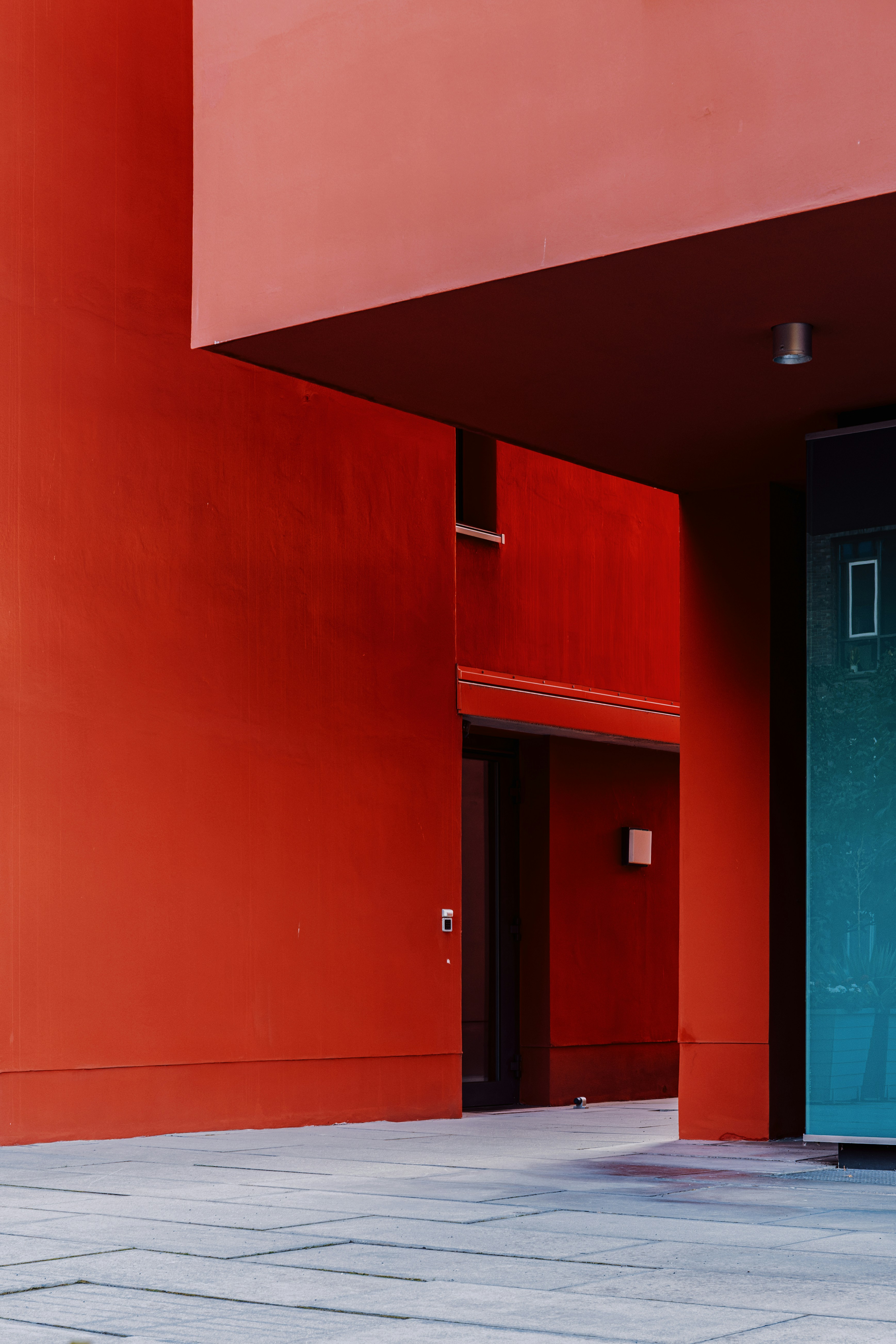 Red Architecture Corridor: A Geometric Play of Color and Shadow