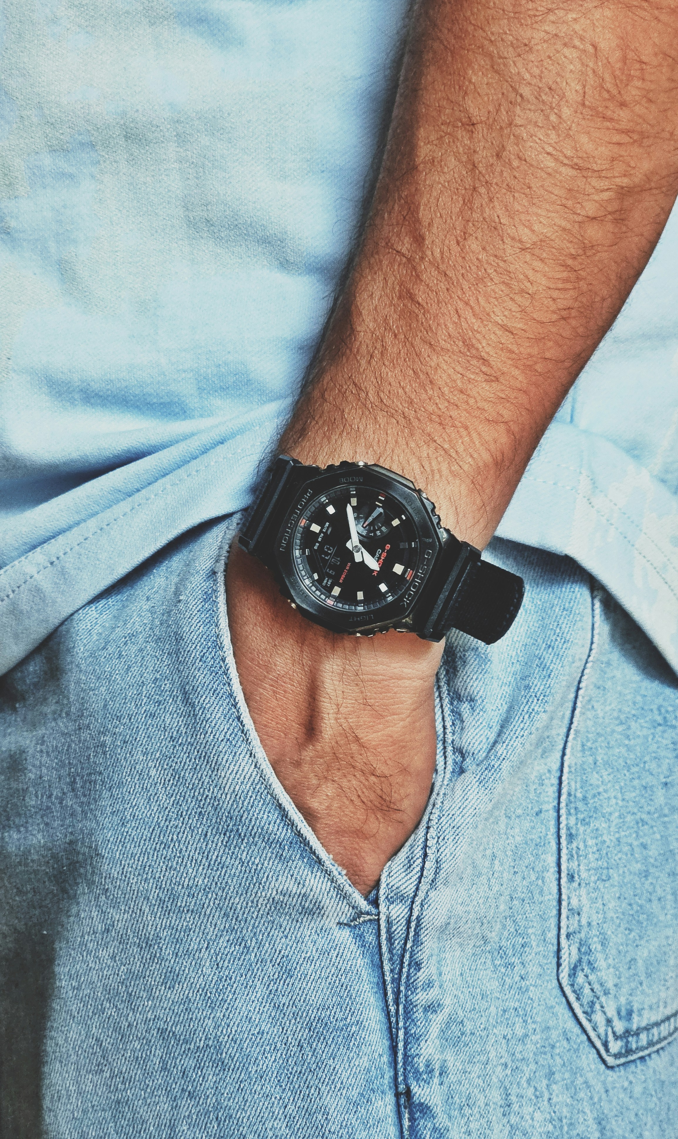 Wristwatch in denim: a close-in study of texture and detail