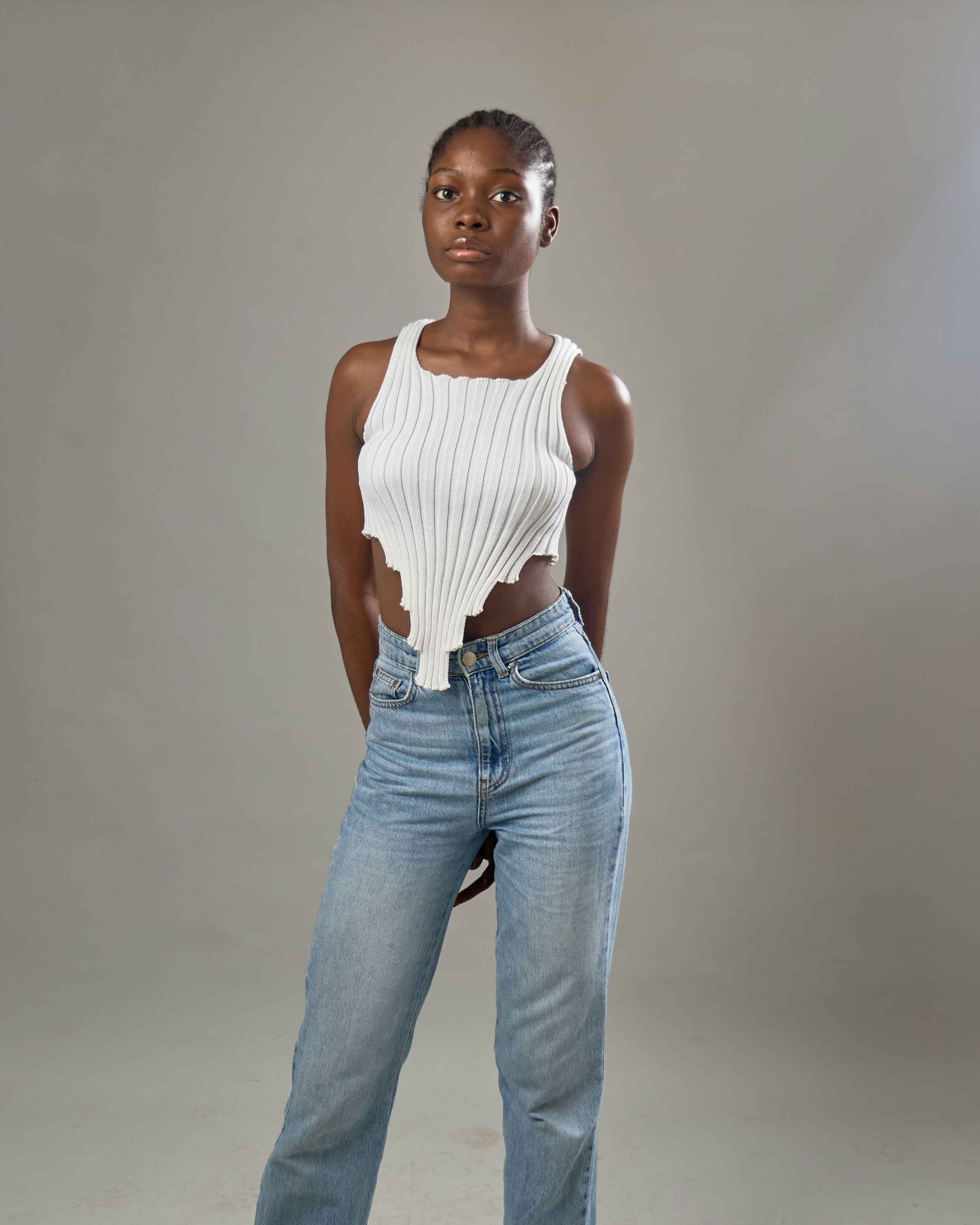 Minimalist Pose, Strong Frame: A Portrait in Denim and White Knit