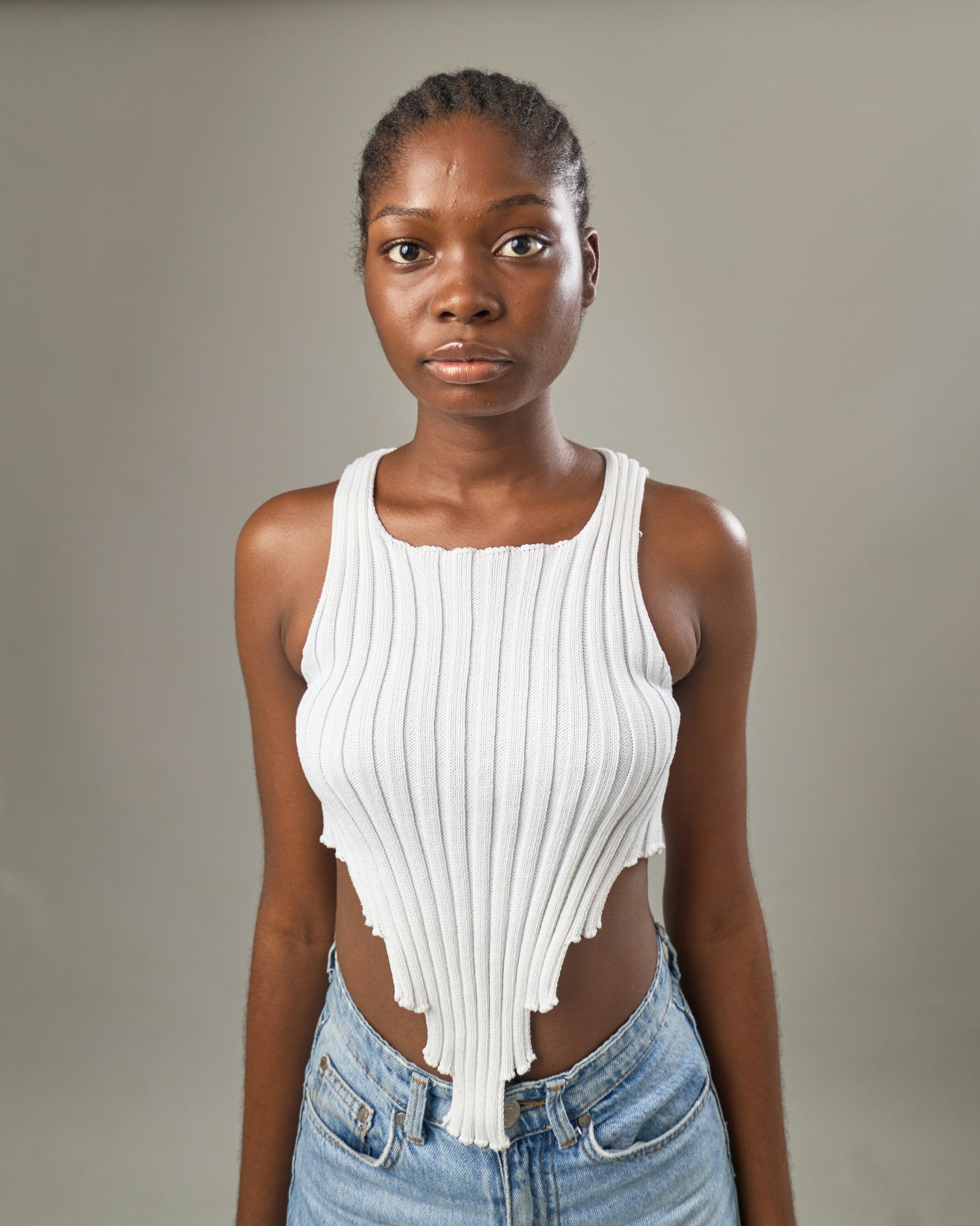 Portrait in Focus: Strength and Stillness in a White Knit