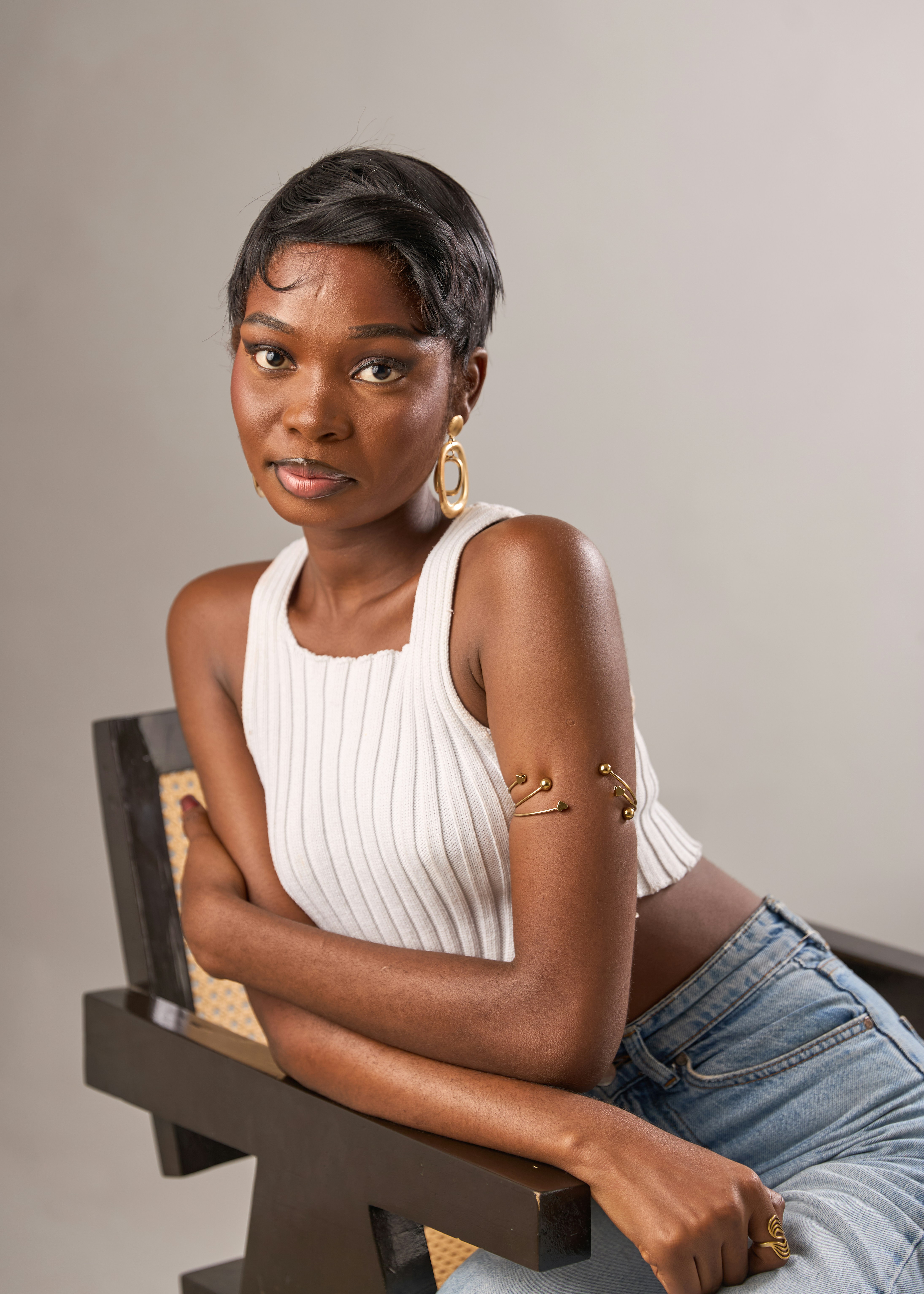 Poised Confidence: Portrait of a Woman on a Wooden Backrest