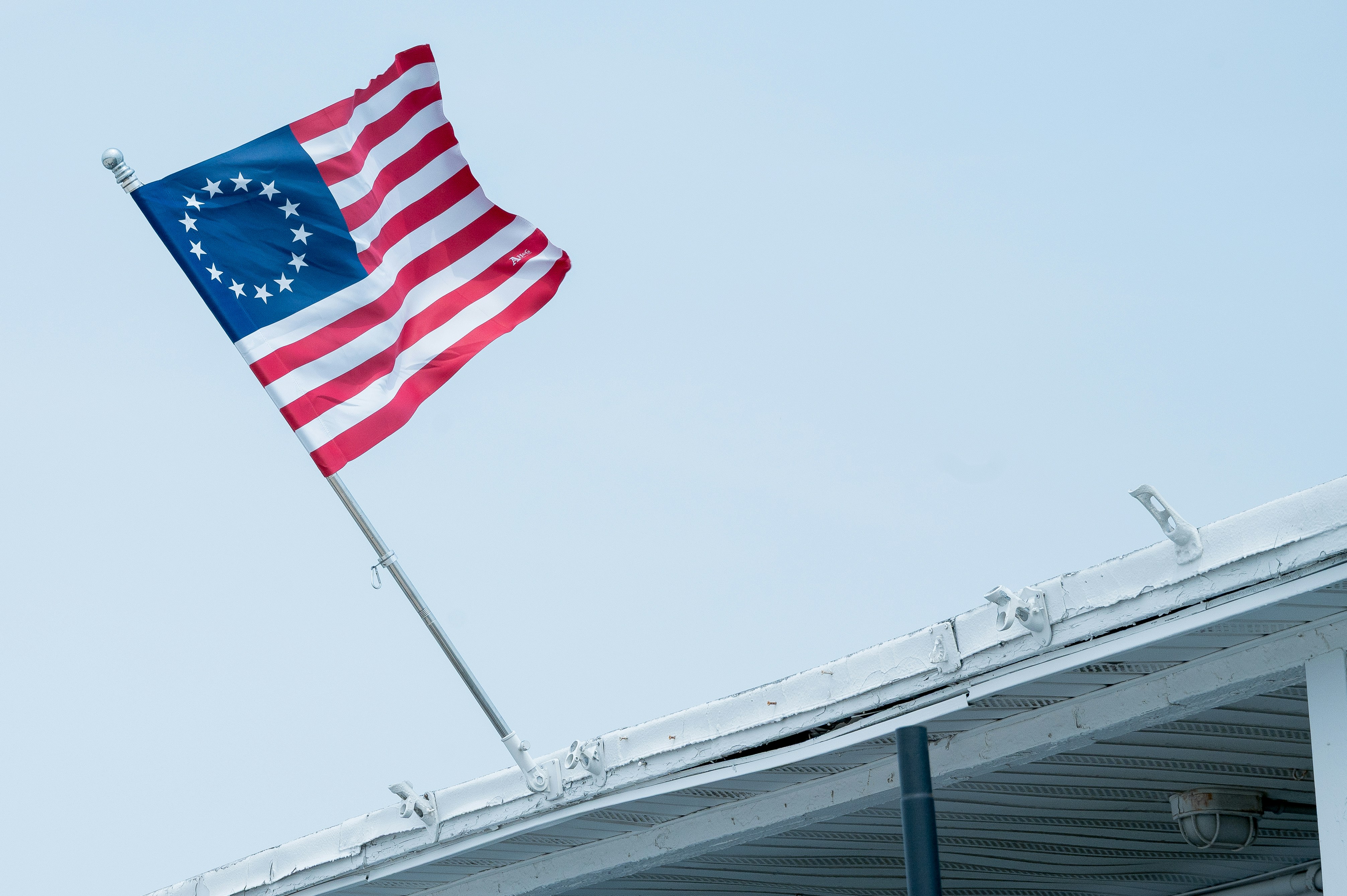 Flag on the Roof Ridge: a Crisp Morning Lean