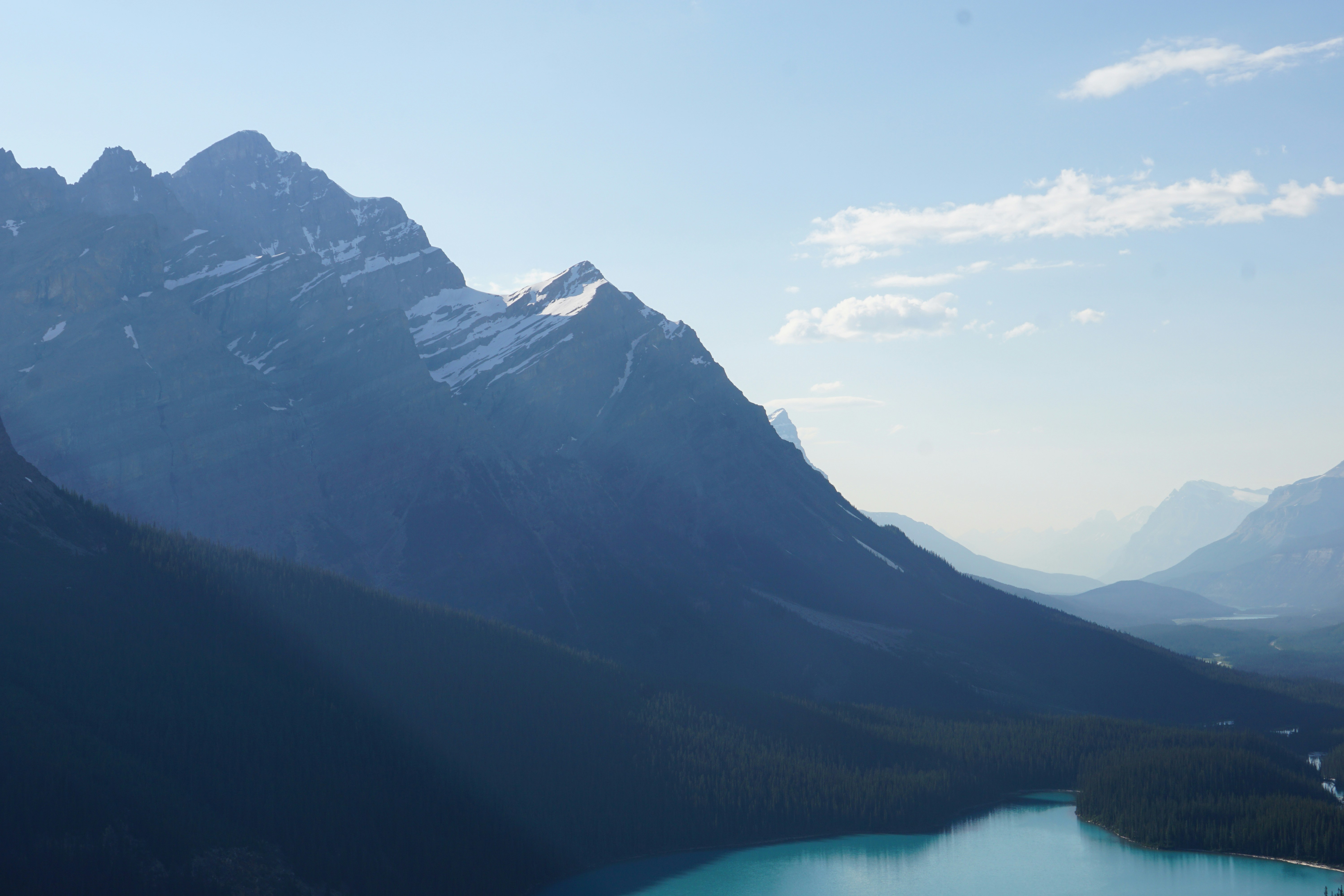 Snow-kissed Peaks Over Turquoise Fjord Valley