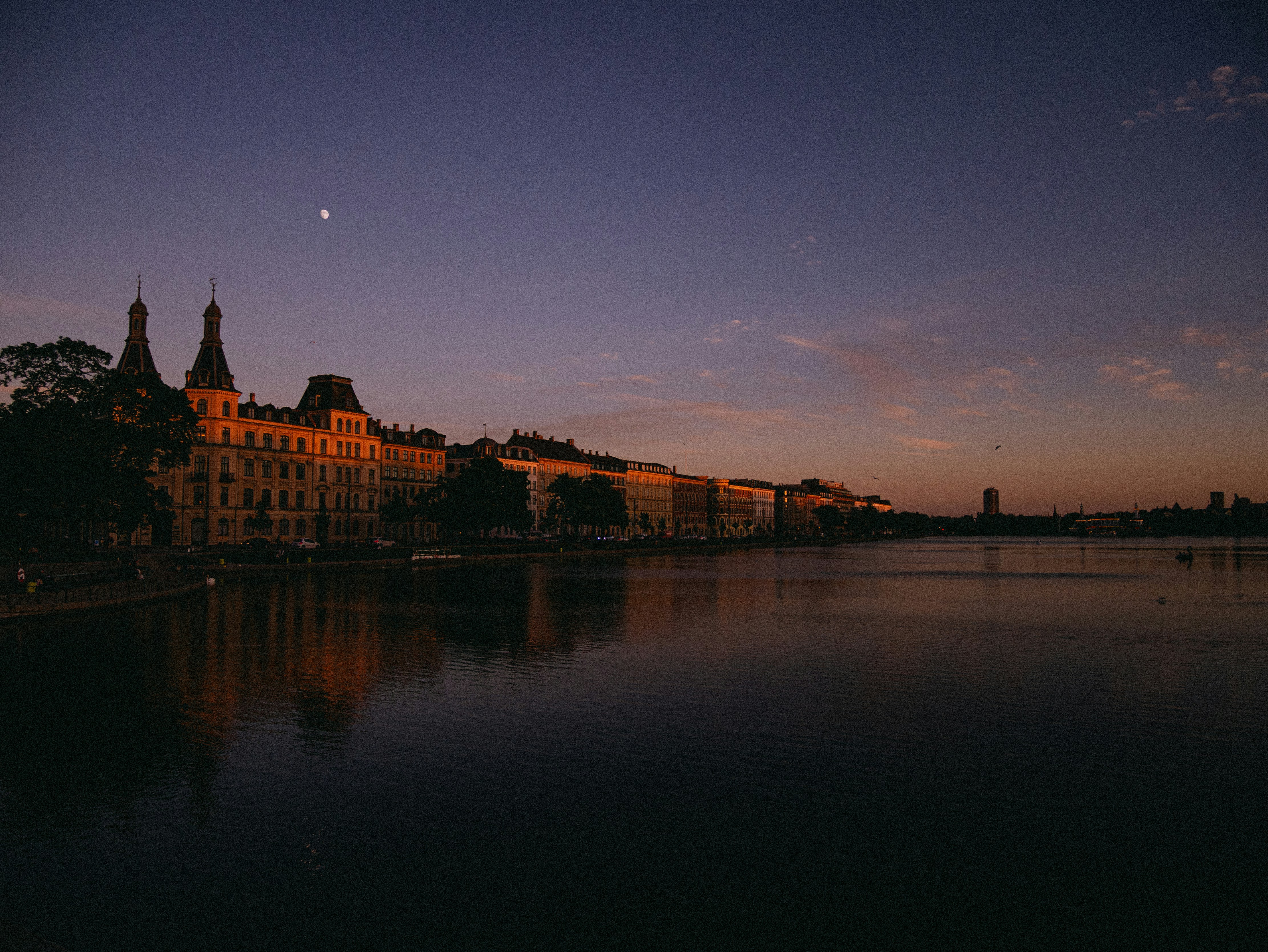Twilight Terrace: A Riverside Cityscape Bathed in Dusk